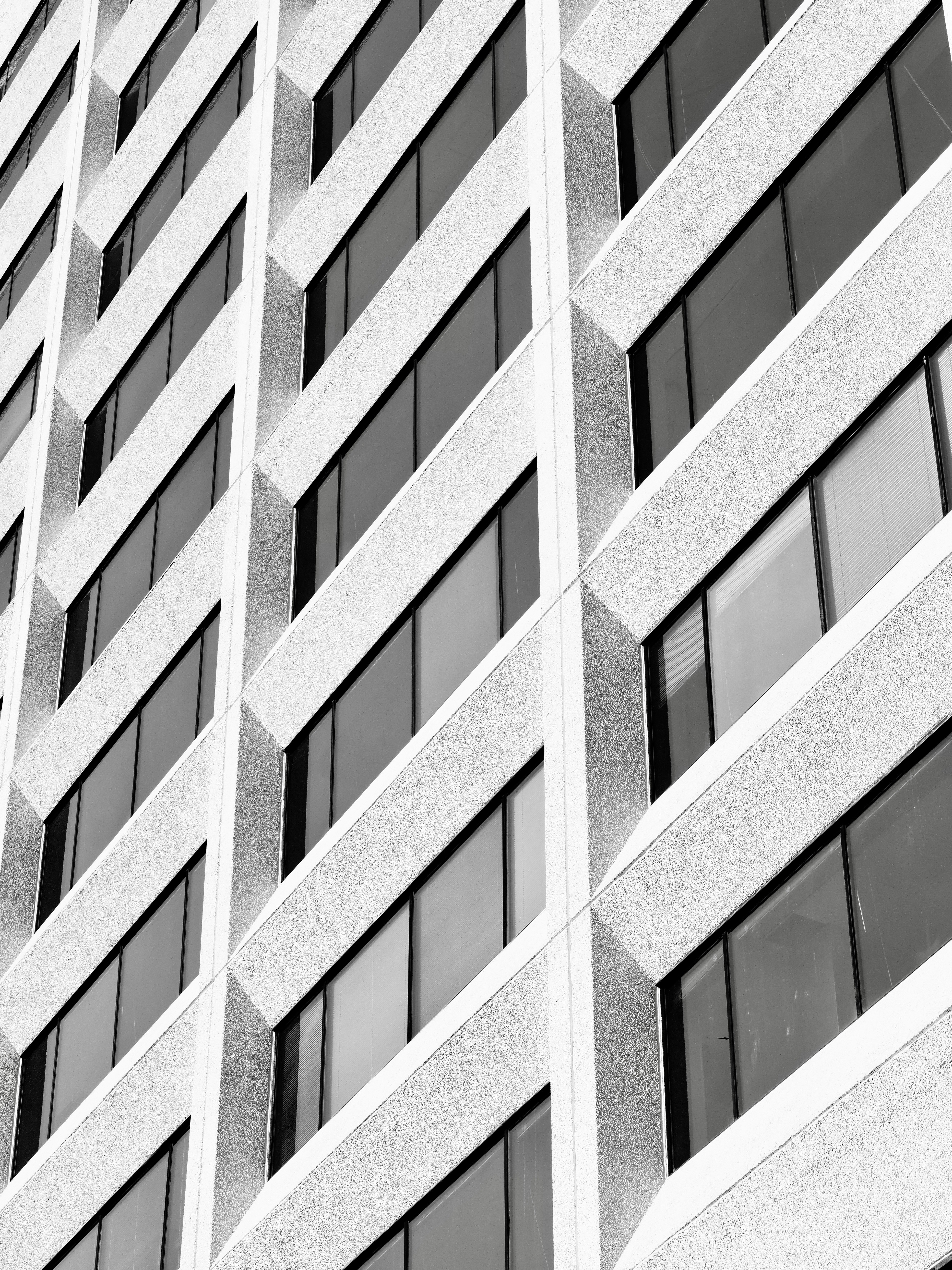Diagonal Grid: Concrete Facade Ripples of Light and Shadow