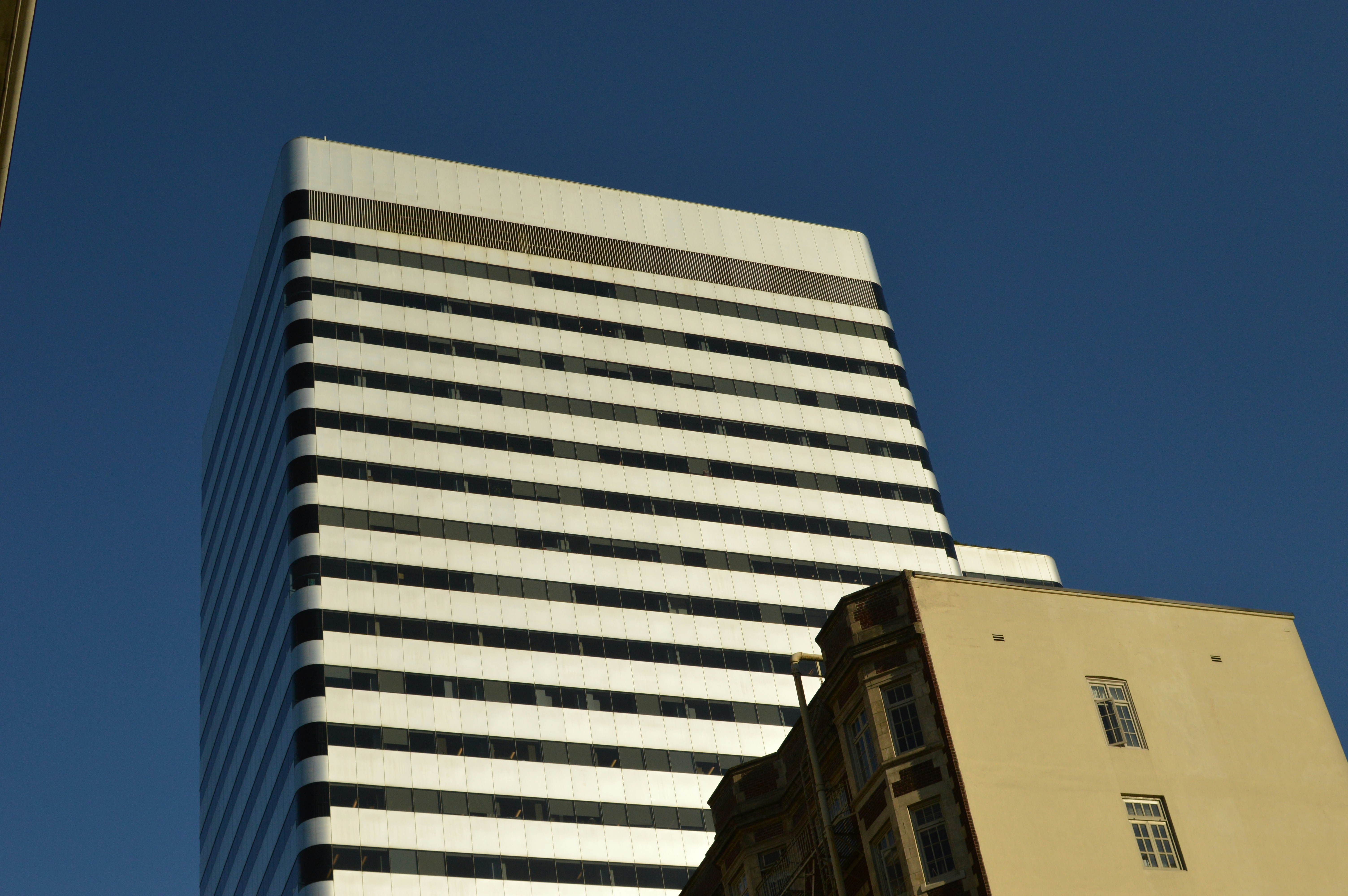Skyscraper Against a Clear Azure: A Converging City Edge