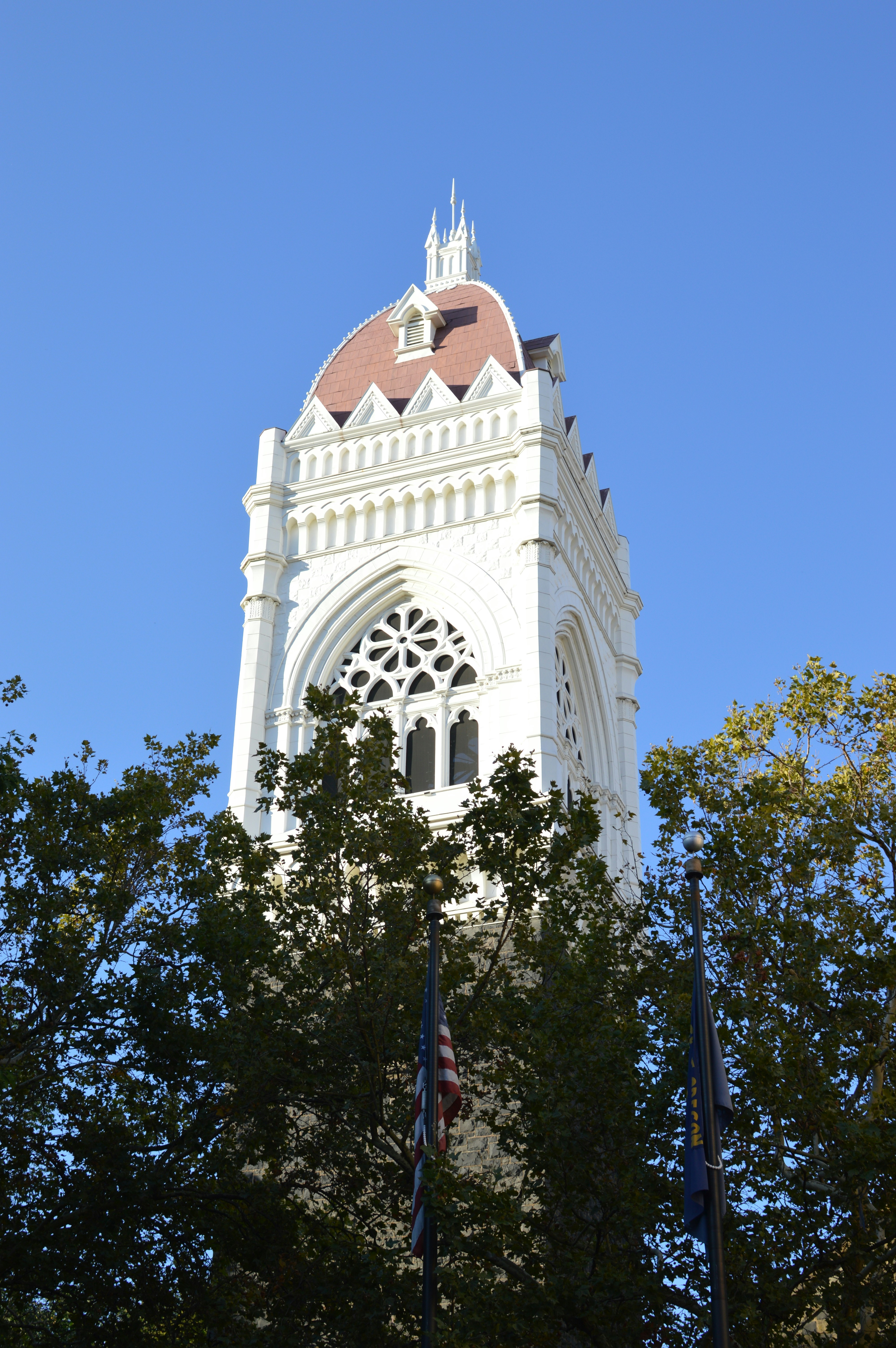 Gothic Clock Tower Piercing the Blue Sky