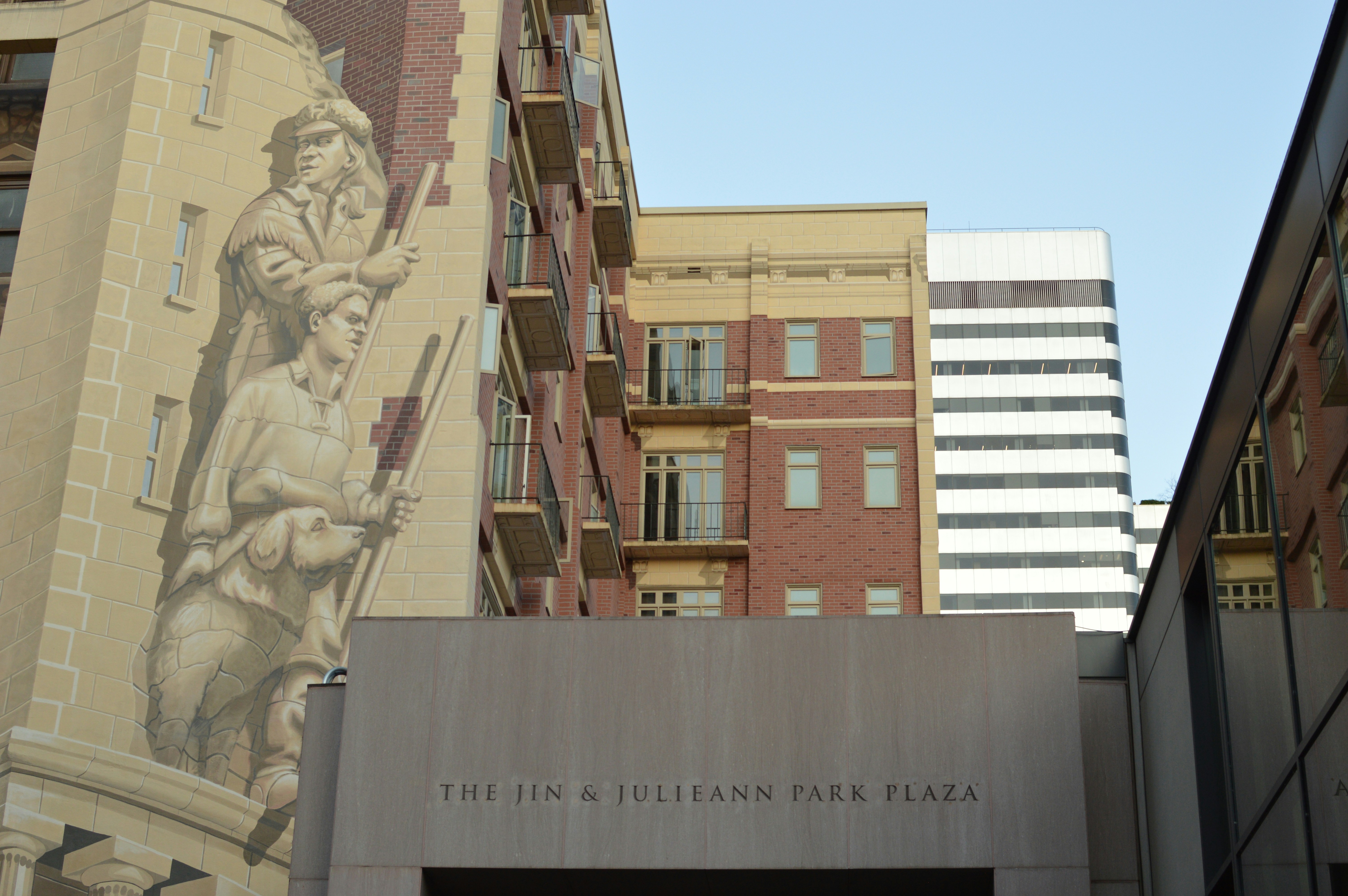 Stone Sculptures Guard the Plaza: A Cityscape Portrait