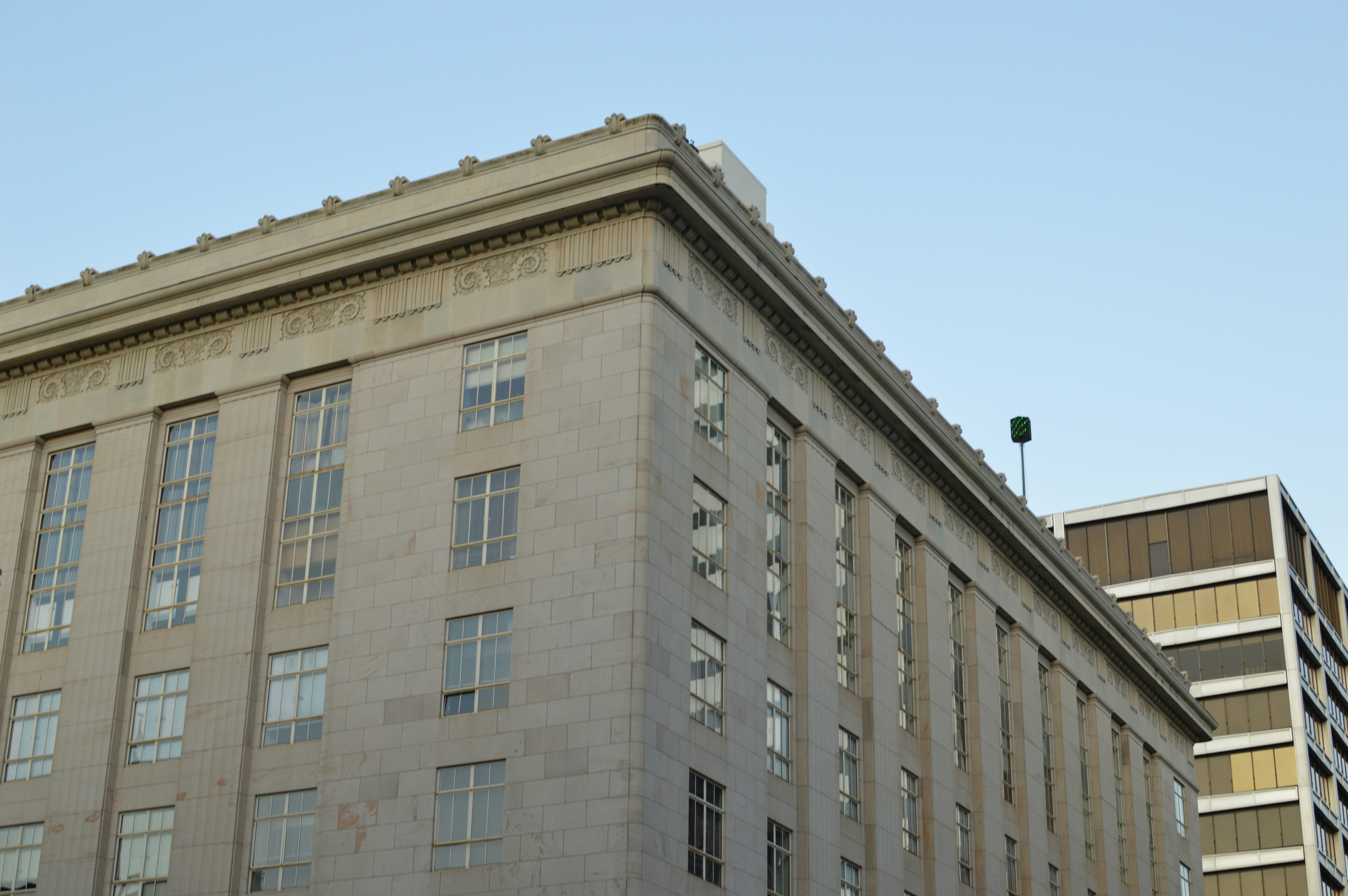 Corner of a Historic Bureaucracy: Sunlit Facade and Sky