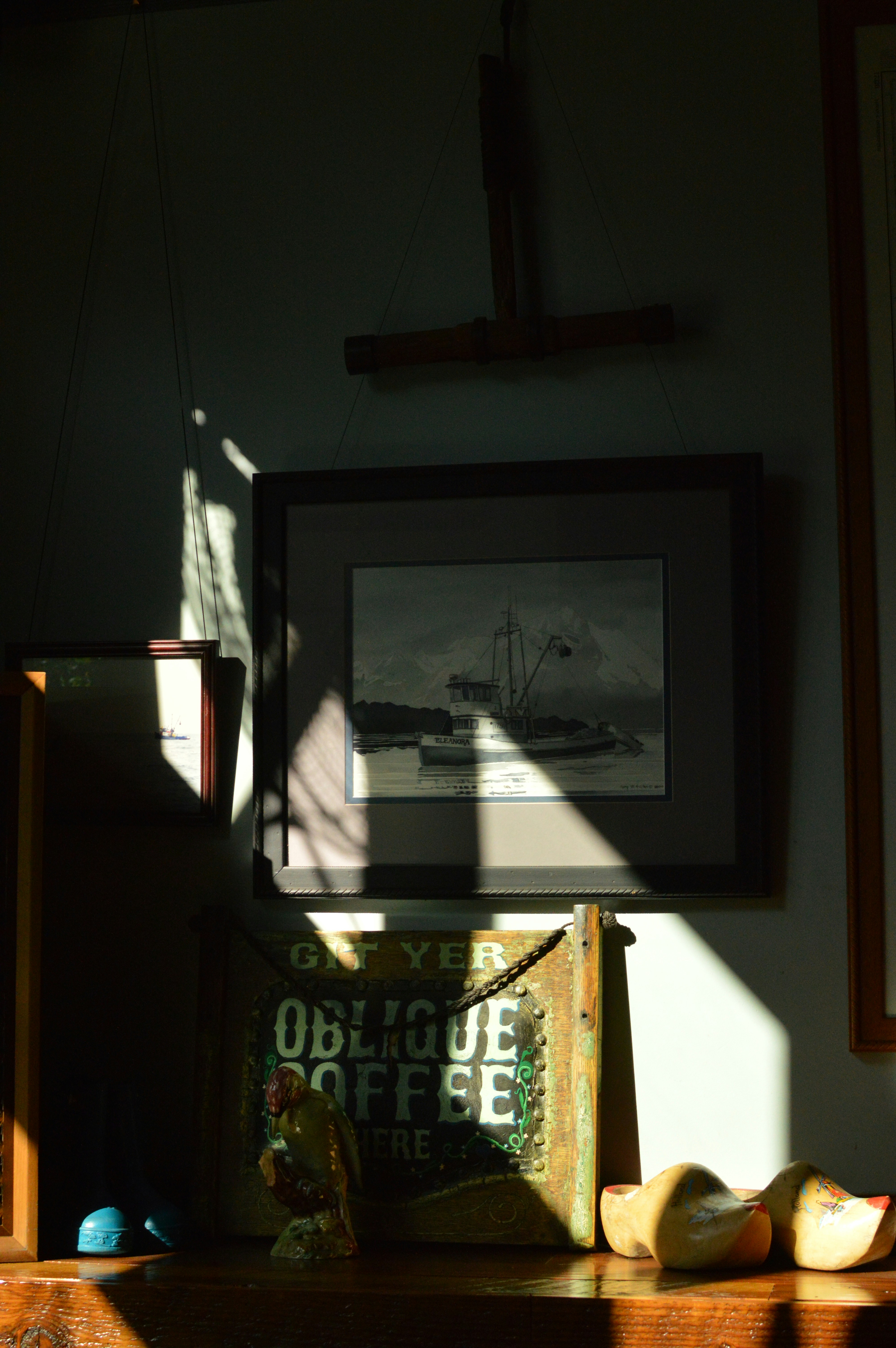 Framed Quiet: A Sunlit Moment in a Shadowed Gallery