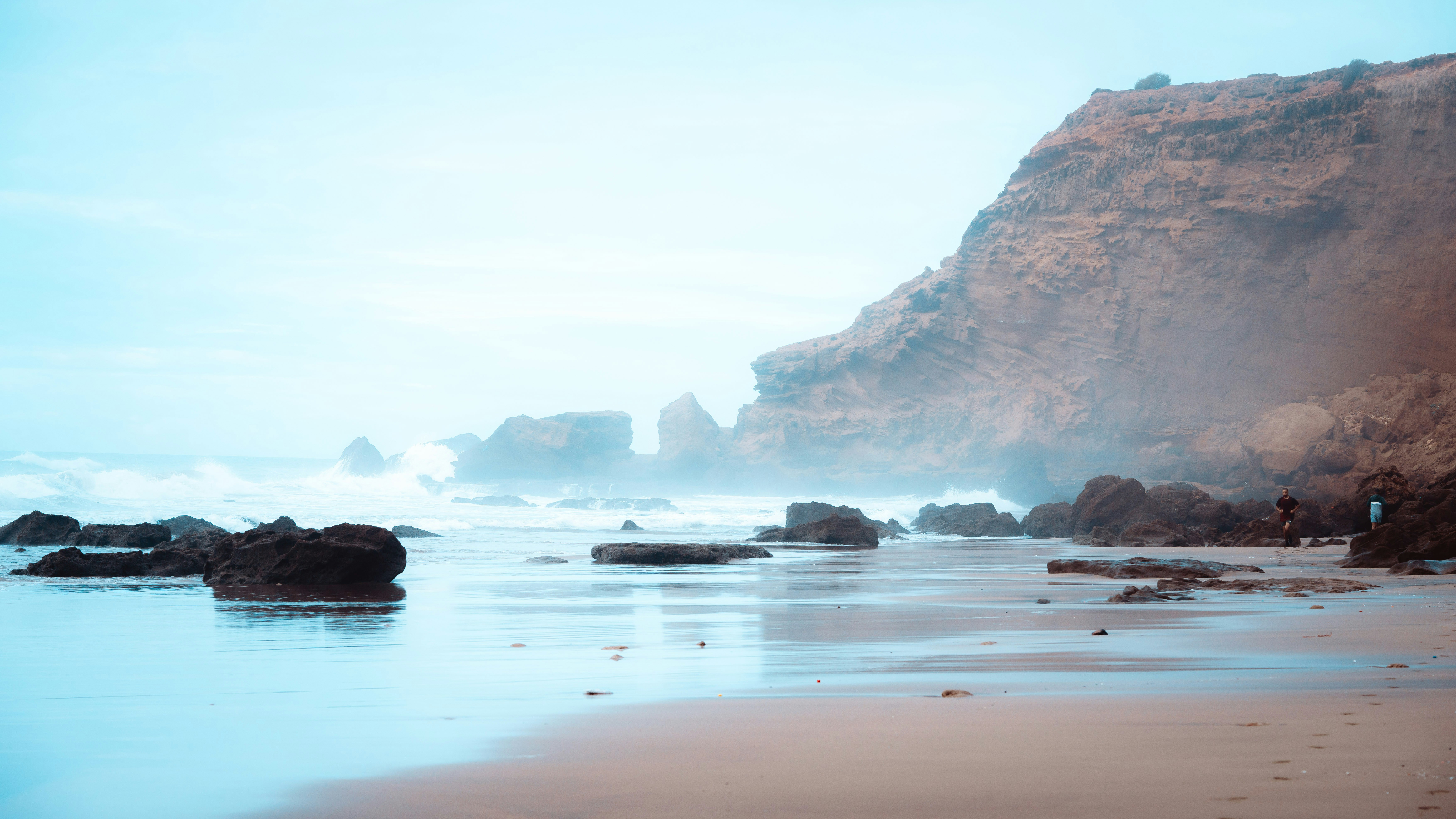 Coastal Mist: Rock Outcrops and Quiet Shoreline in Blue Hour