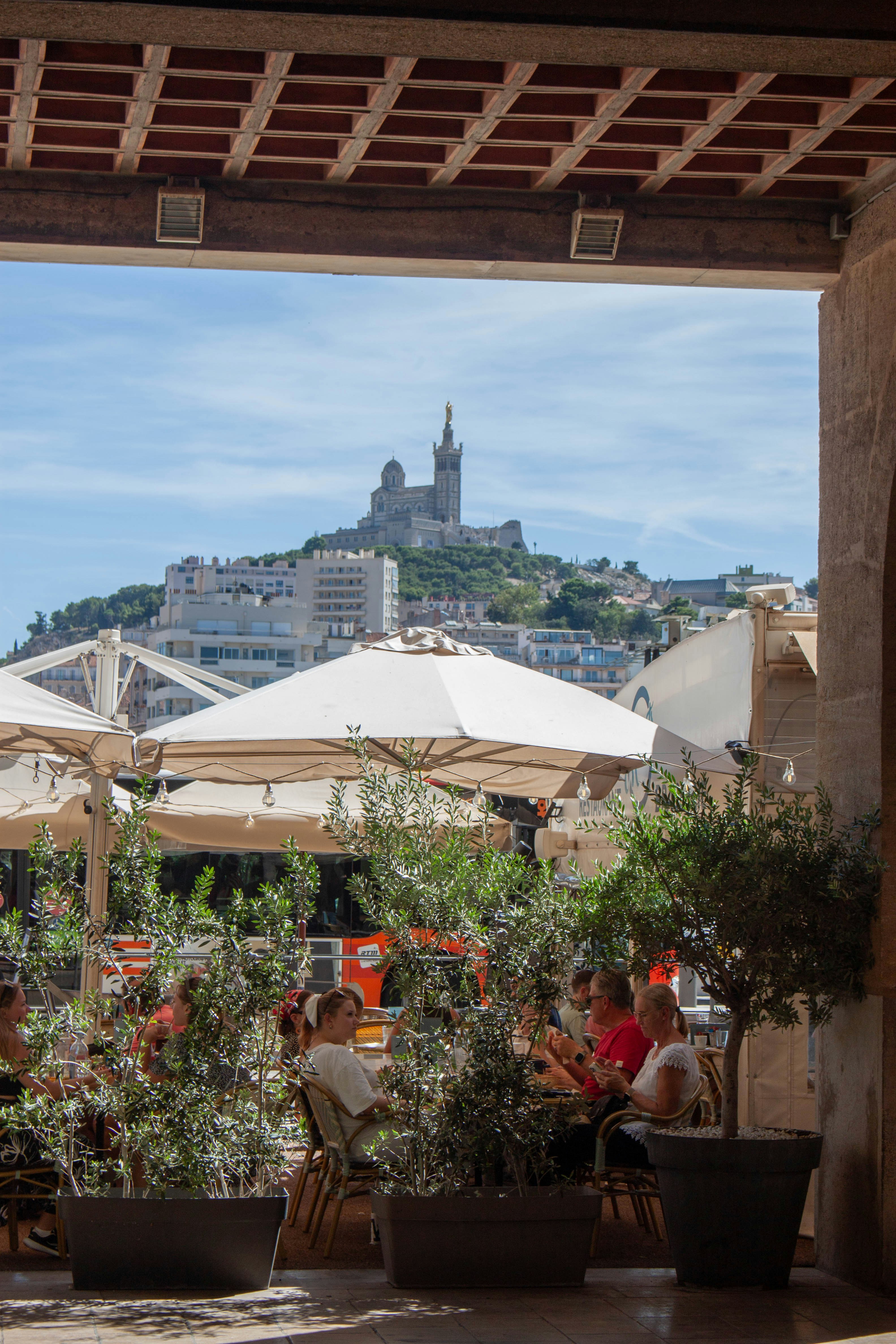 Café Courtyard with Hilltop Cathedral Framing the City