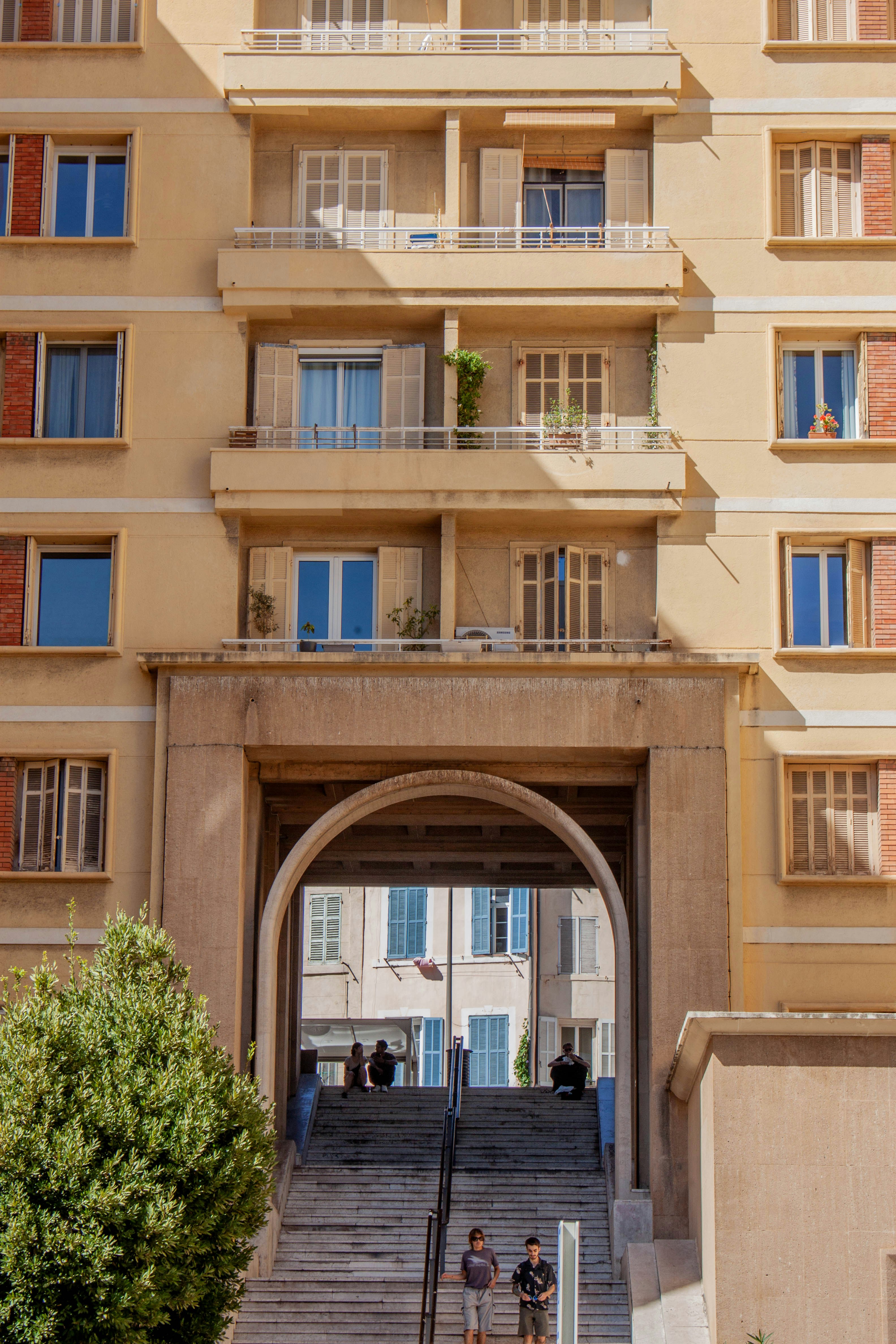 Archway into the Past: Stairs Framing Echoes of a Courtyard