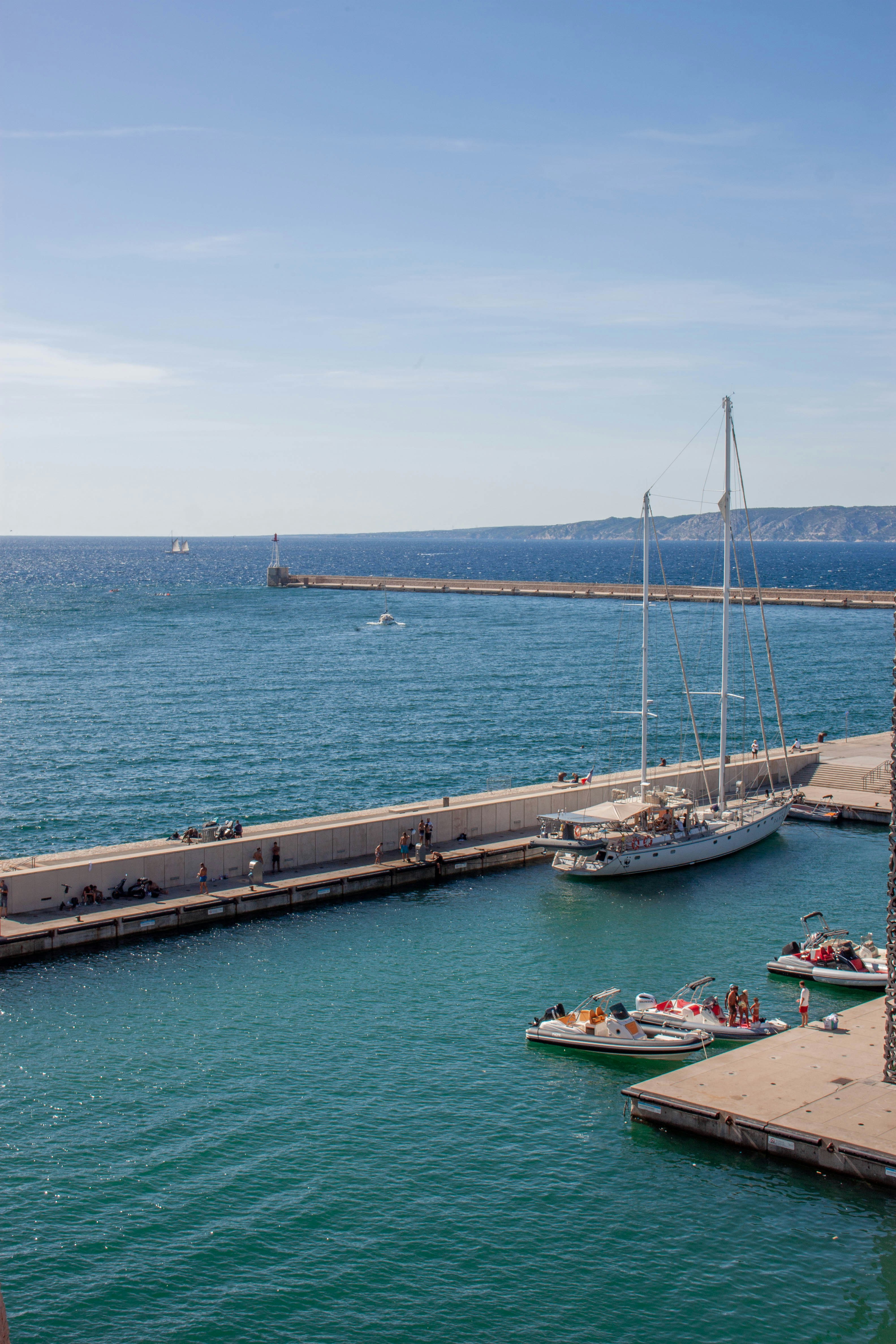 Harbor Lines: A Sunlit Marina Courtyard by the Sea