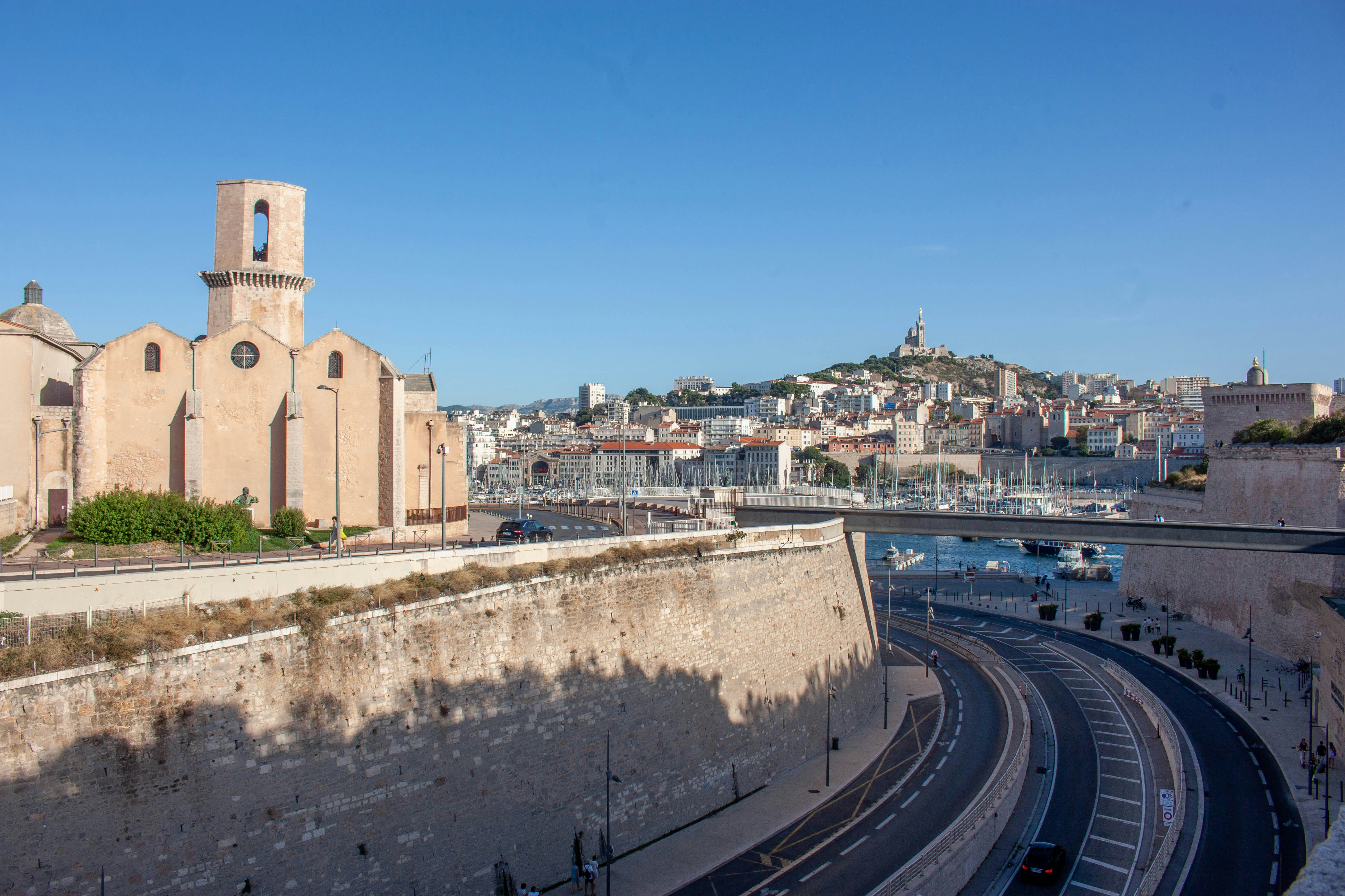 Historic Fortified Wall Overlooking a Bright Harbor City