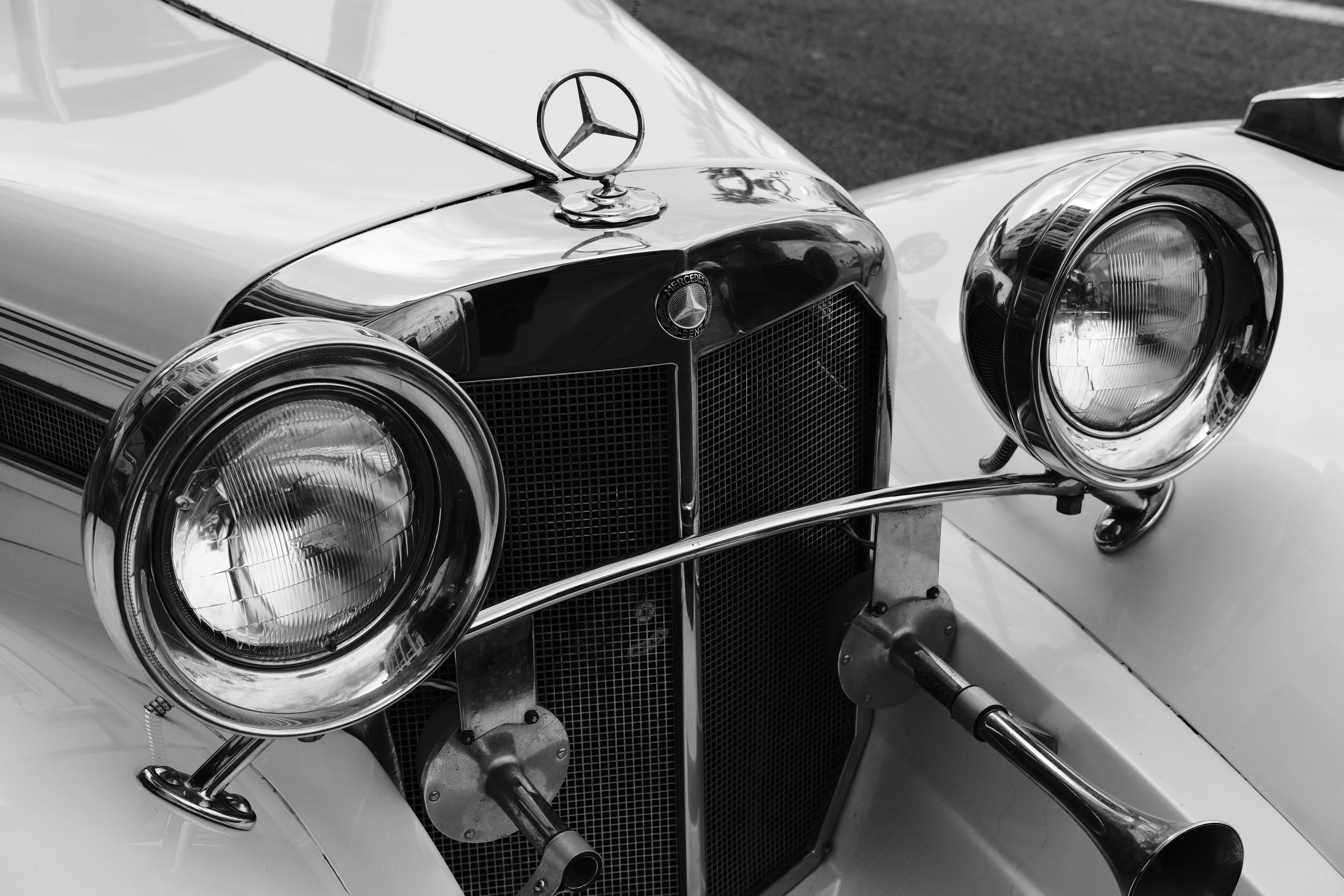Vintage Grille Gaze: Close-Up on Classic Mercedes Hood Ornament
