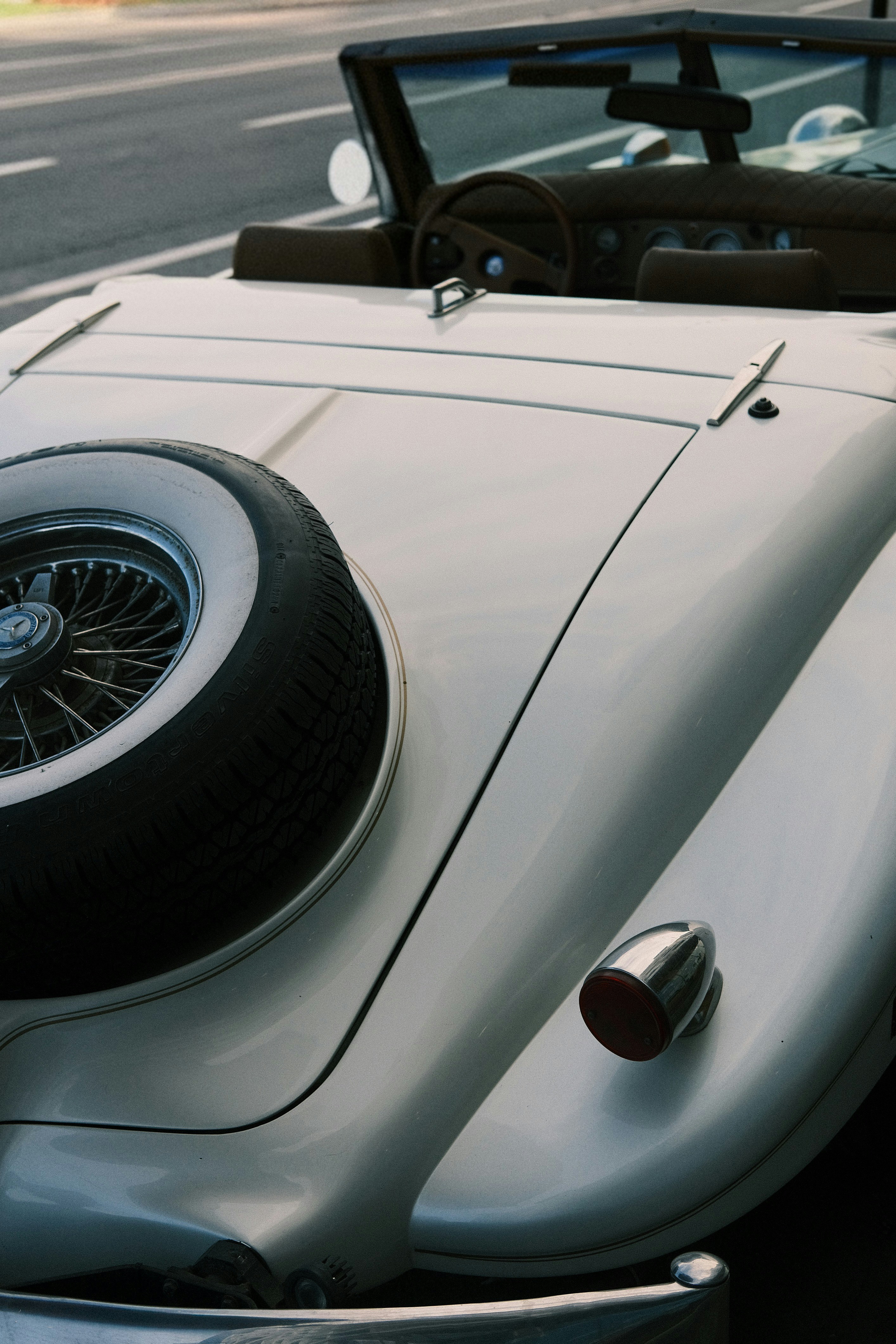 Vintage Convertible Quietly Reveals Its Spare Tire Spoils of a Road Trip