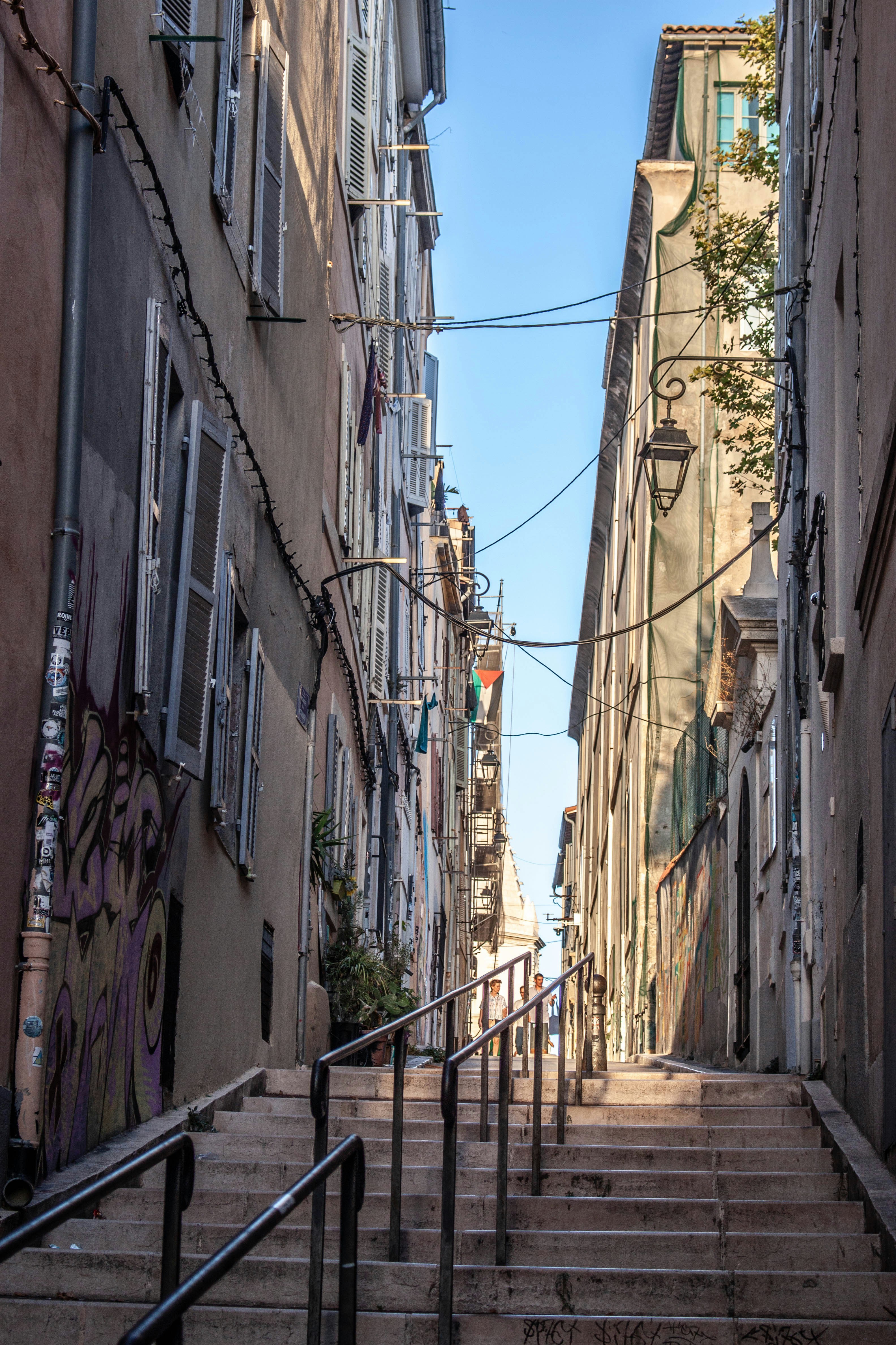 Staircase Through a Sunlit European Alley