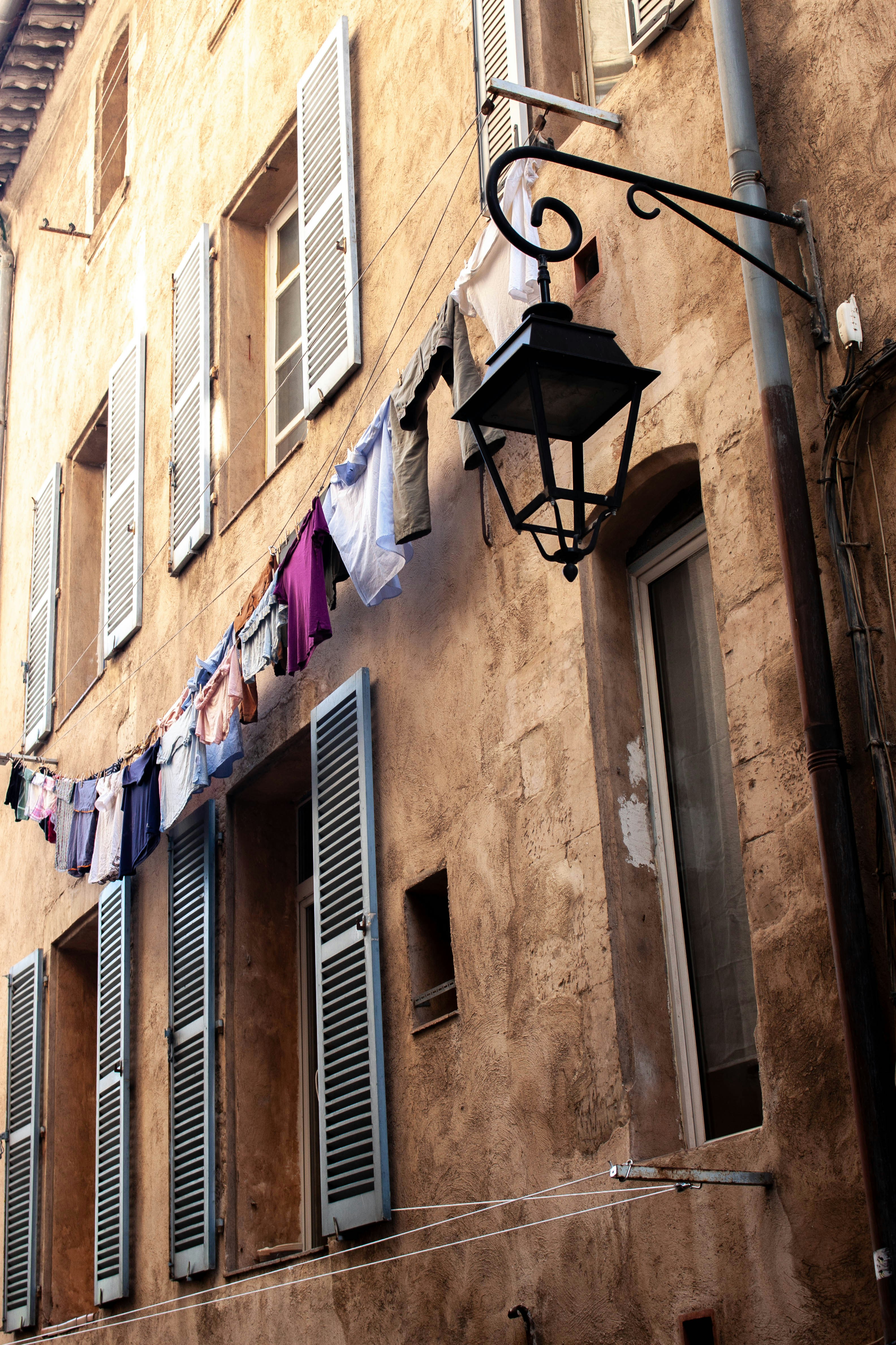 Laundry Line and Lantern on a Warm Aged Wall
