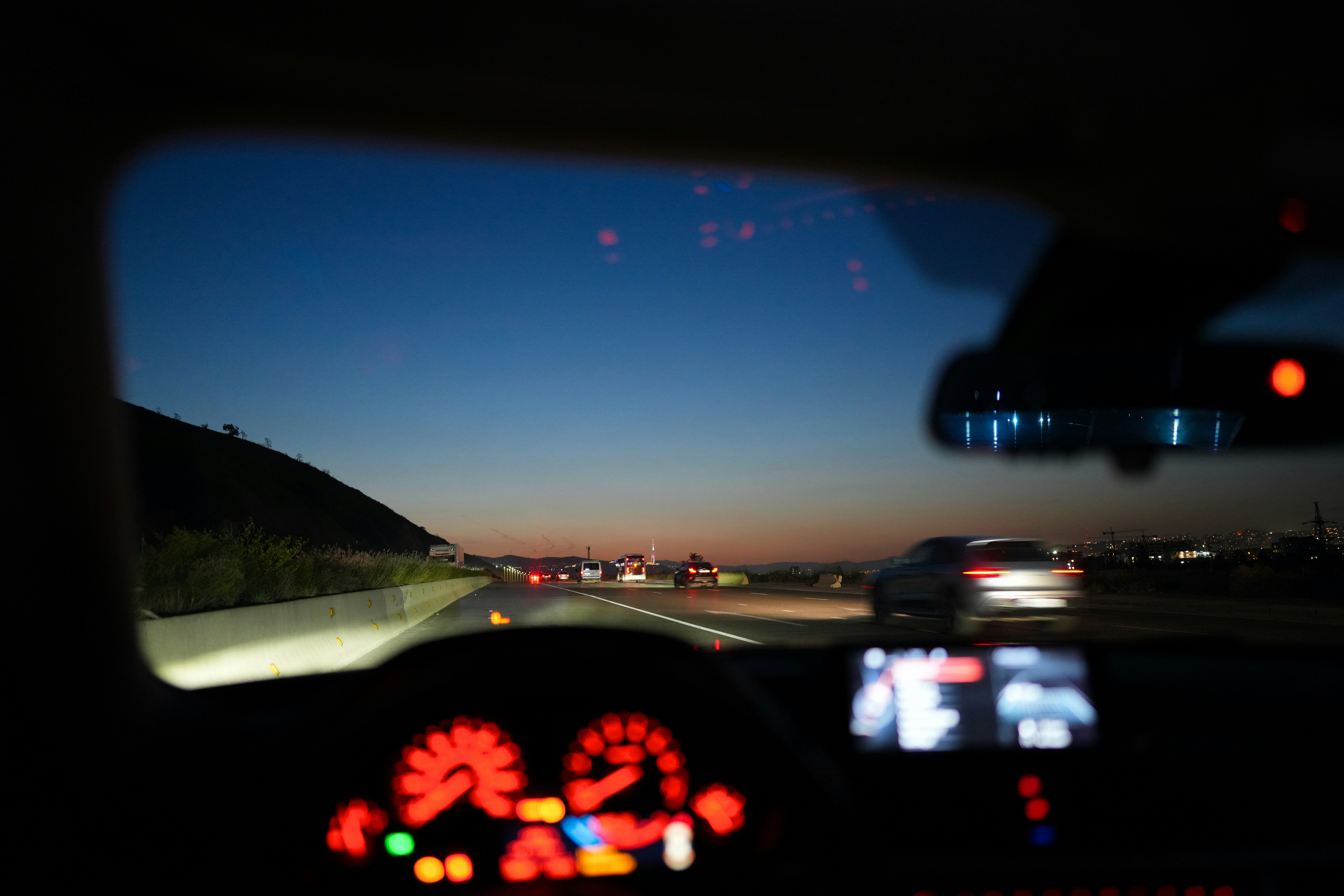 Headlights, Horizon, and Road Blur: A Drive into Twilight