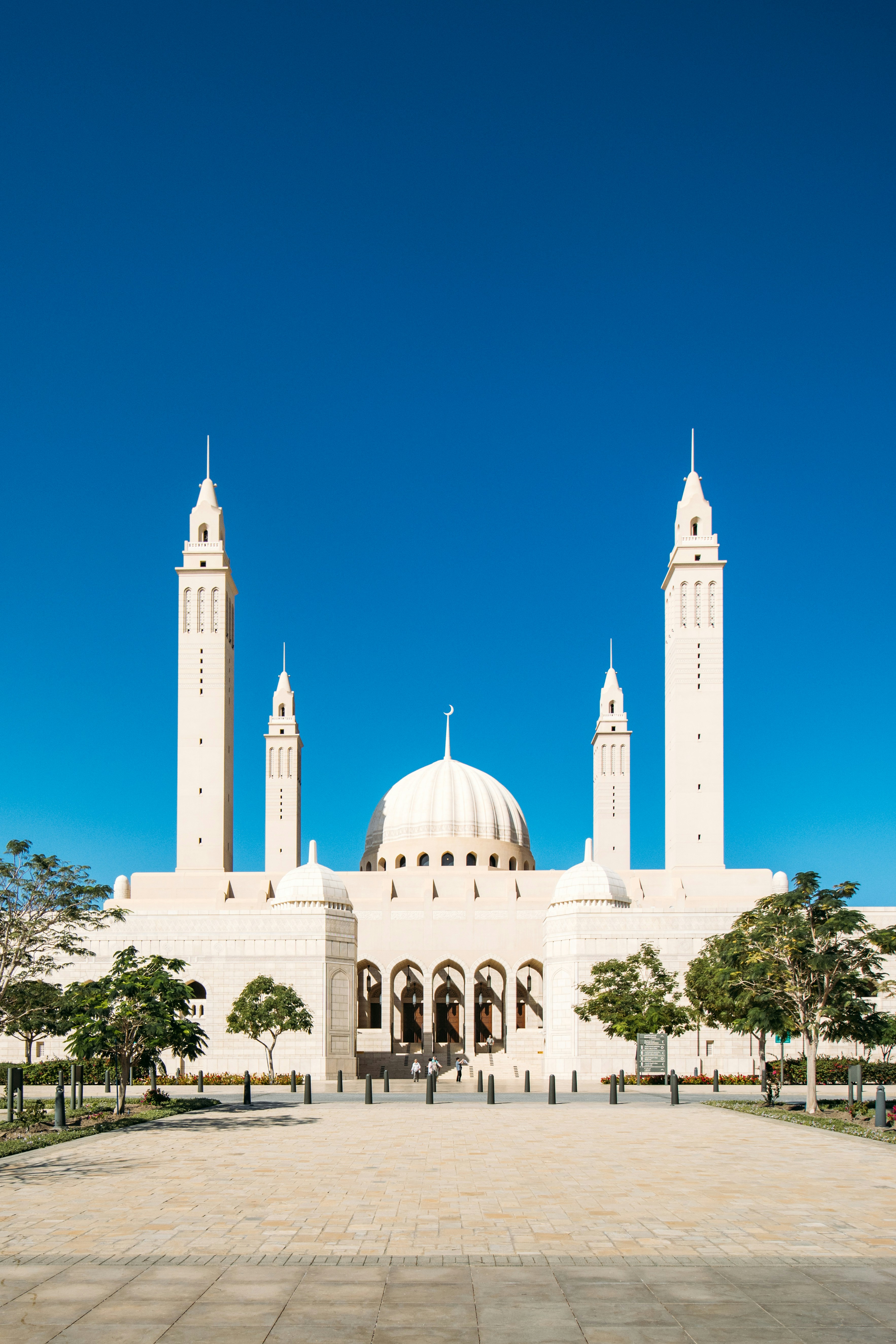 The White Dome at Dusk: Guardians of the Twin Minarets