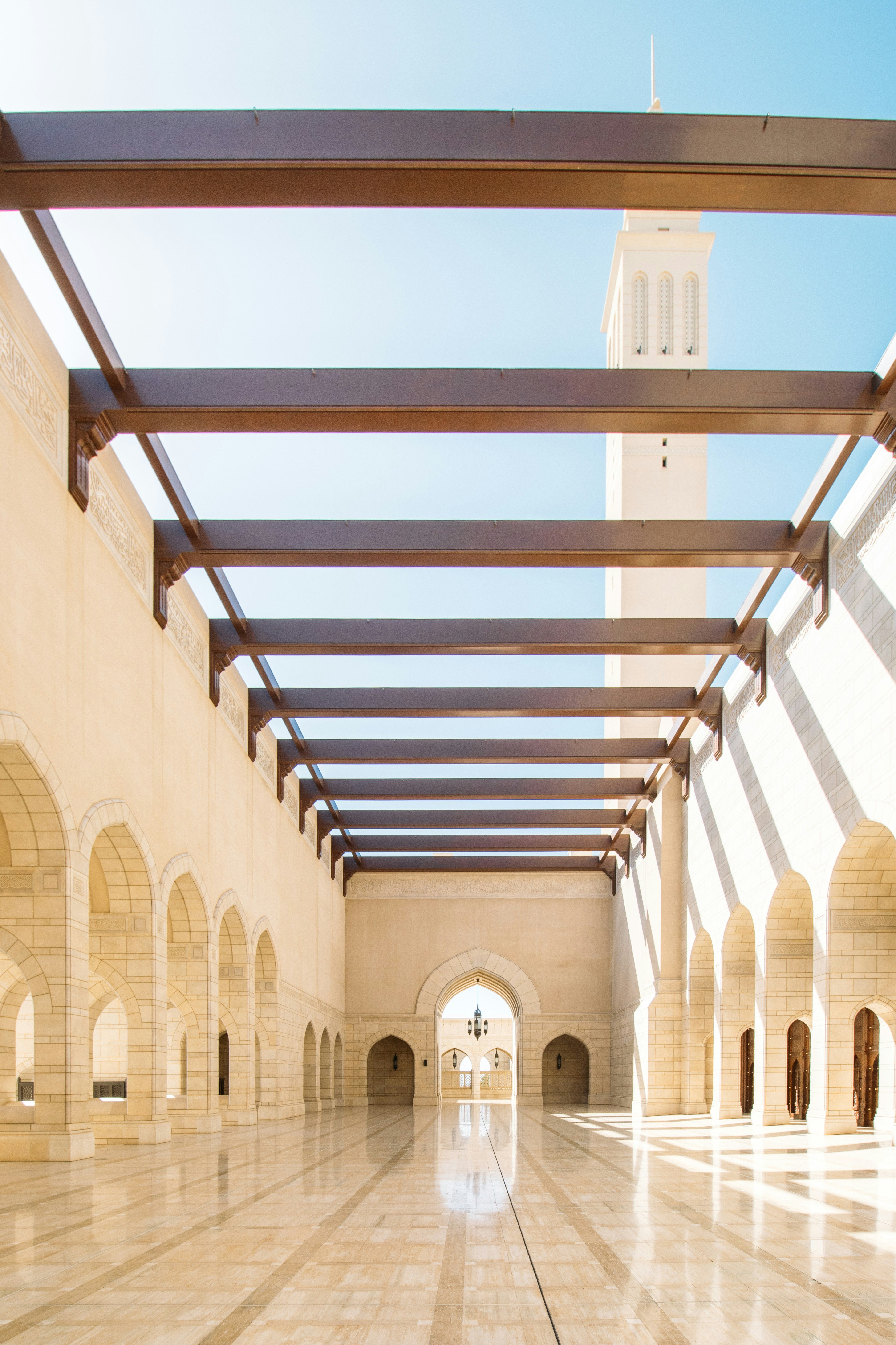 Sunlit Colonnade: Geometry of Light and Shadow in an Infinite Corridor