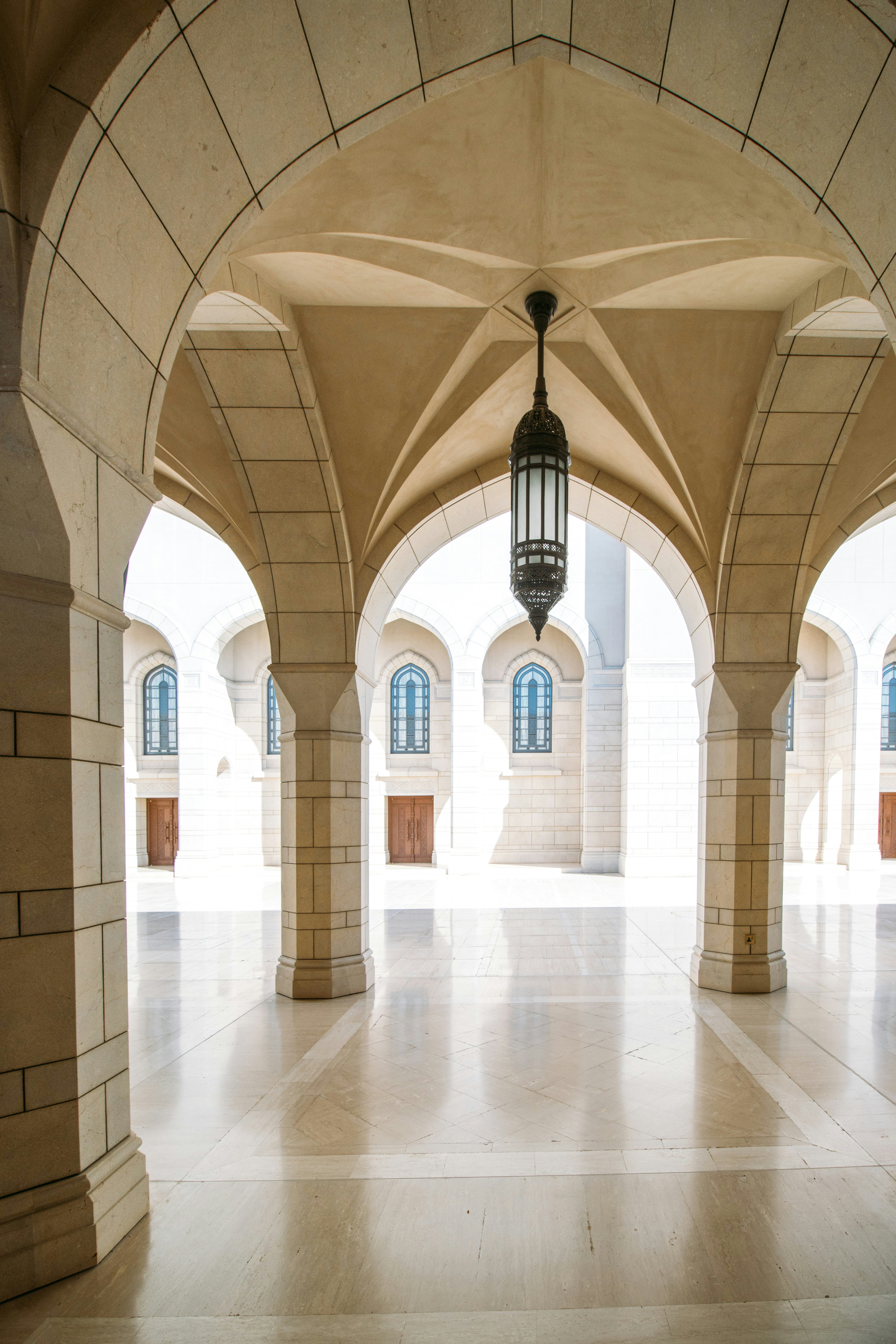 Symmetrical Archway Lantern: Center of Light in Marble Courtyard