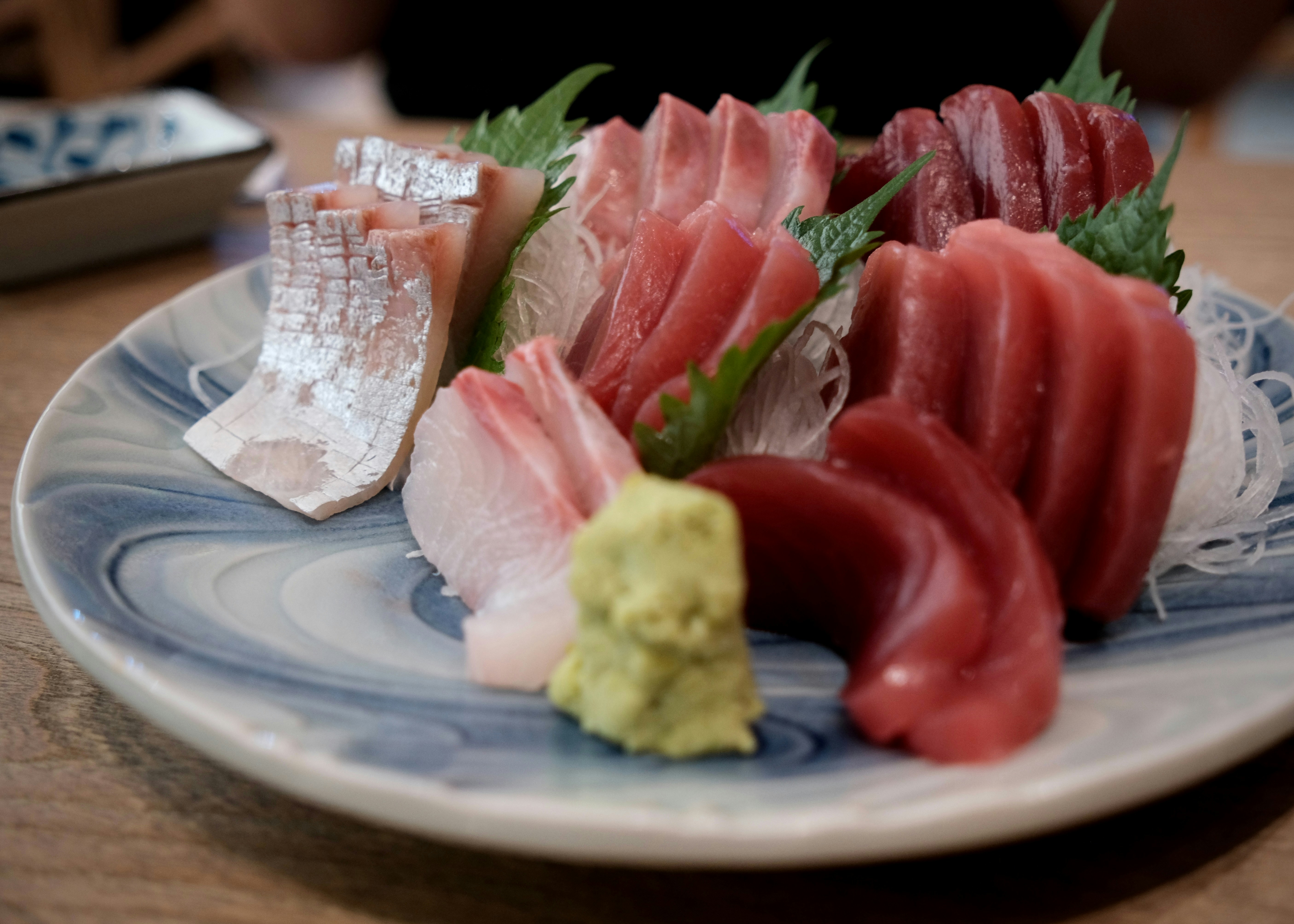 Assorted Sashimi Plate: Vibrant Tuna and White Fish with Wasabi Accent