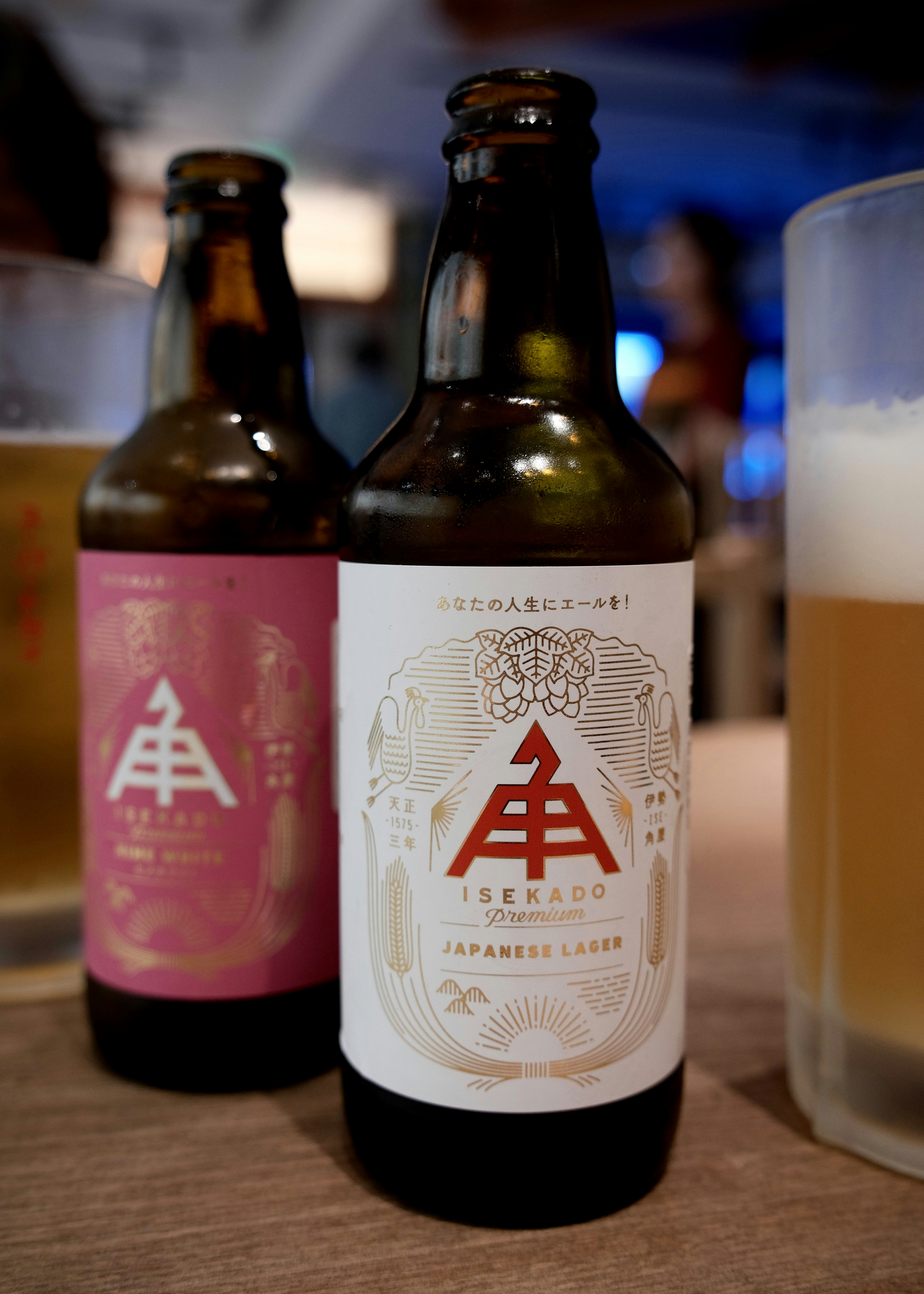 Center Stage Brew: Japanese Lager Bottle with Two Taps of Glass and Foam