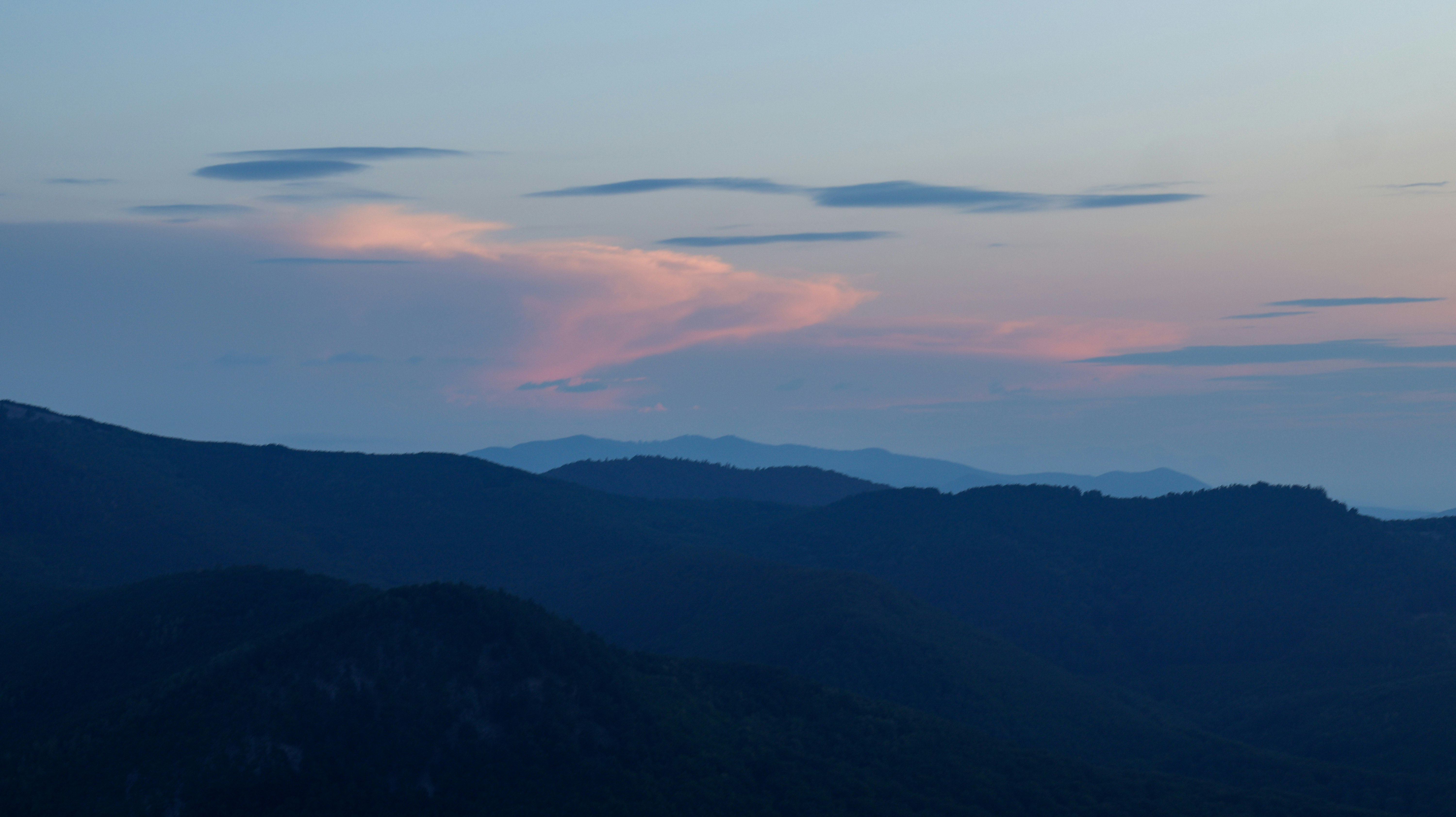Dusk Over the Silent Valleys: A Veil of Blue Hills