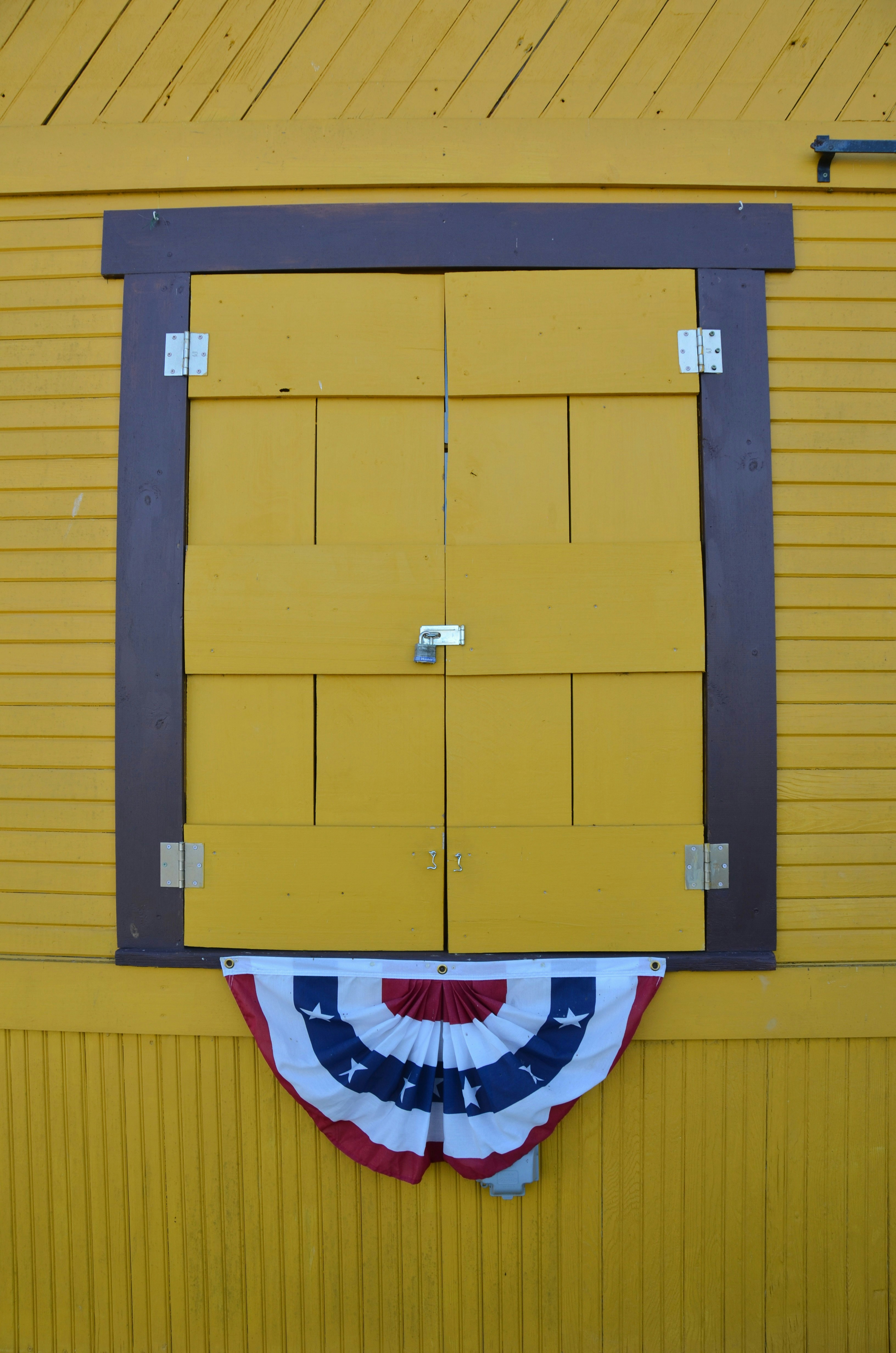 Yellow Cargo Door with Patriotic Drapery