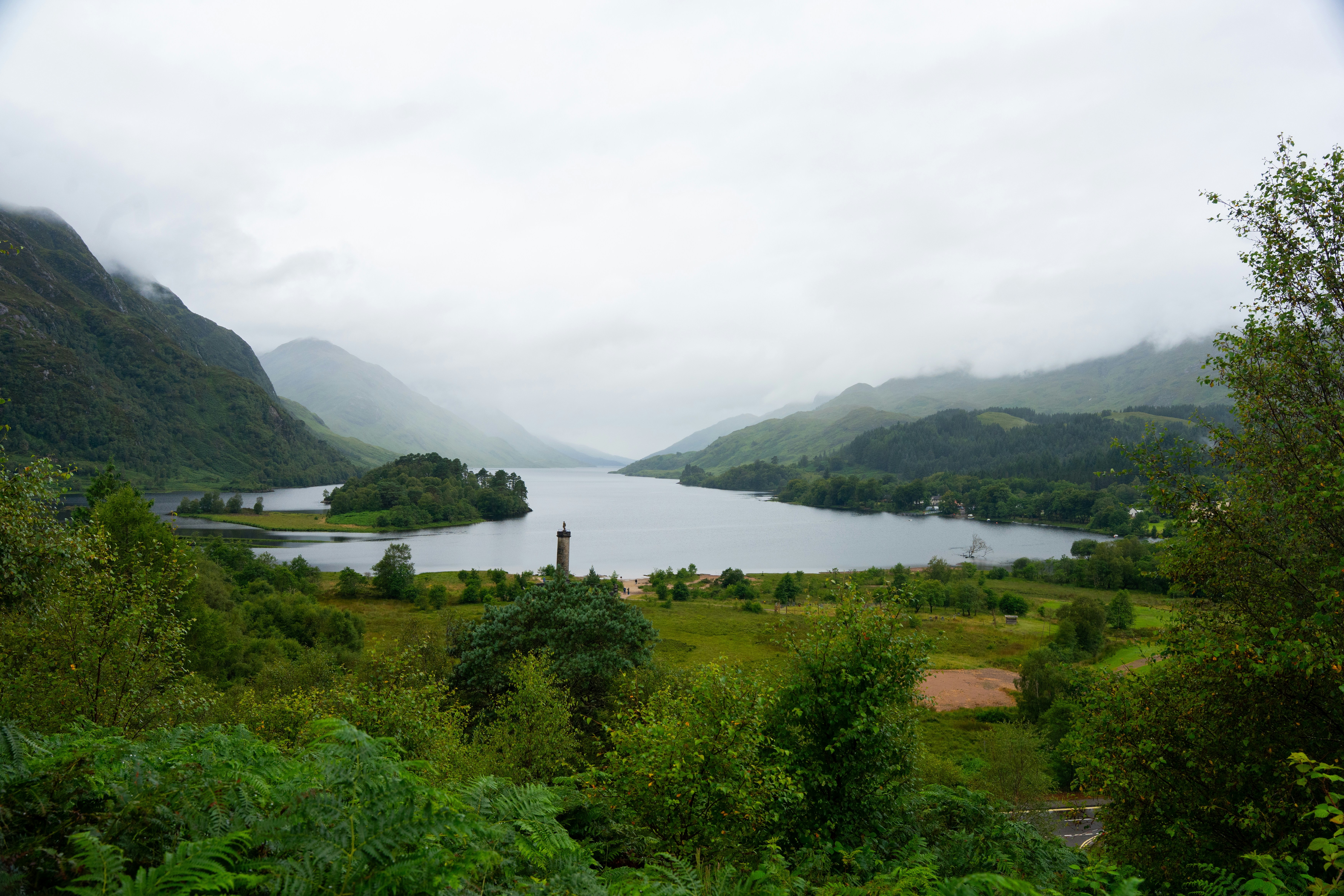 Misty Fjord Valley: A Quiet Lake Between Green Slopes