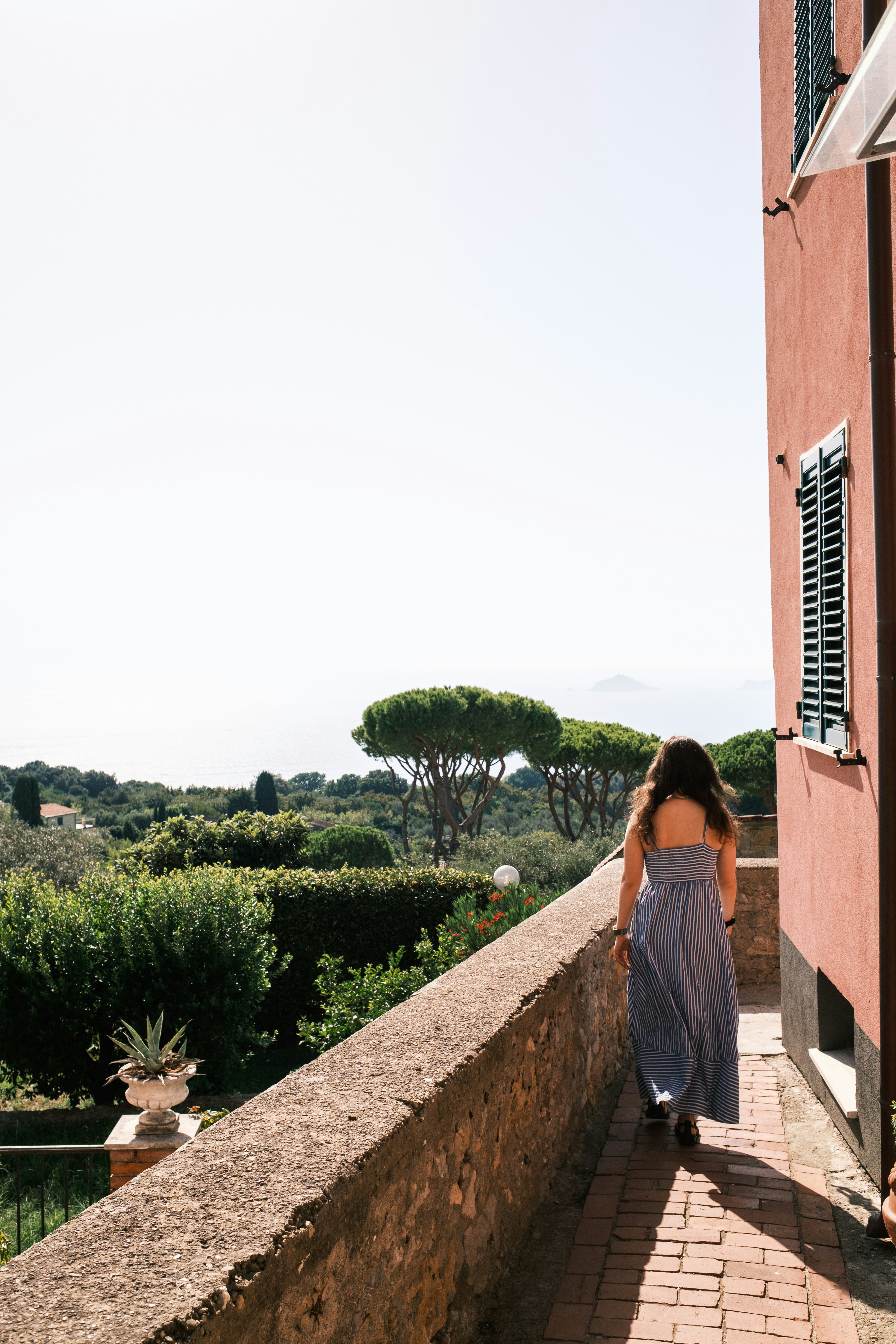 Sunlit Terrace Stroll toward the Sea