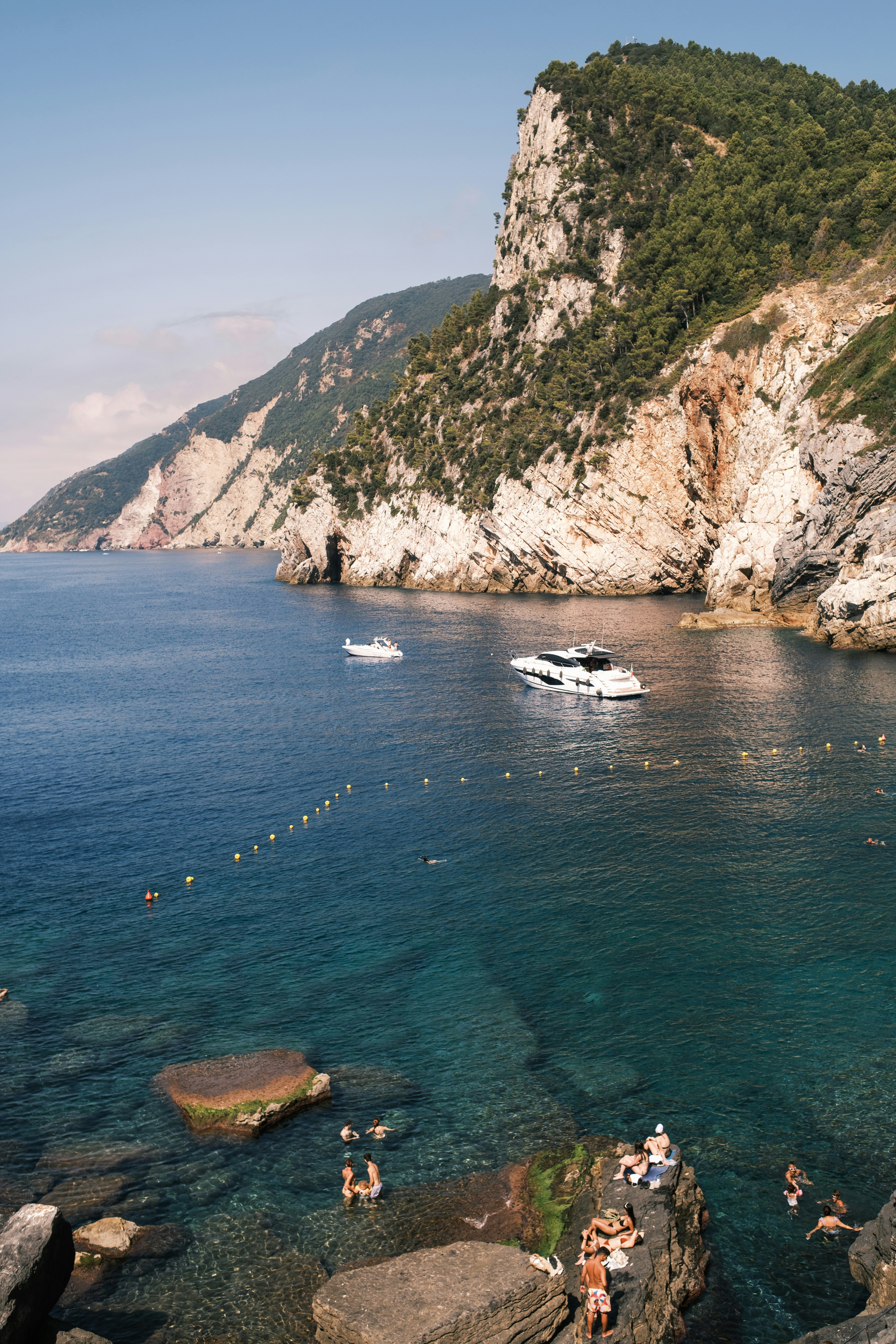 Harbor Silence: Boats at the Foot of a Cliff