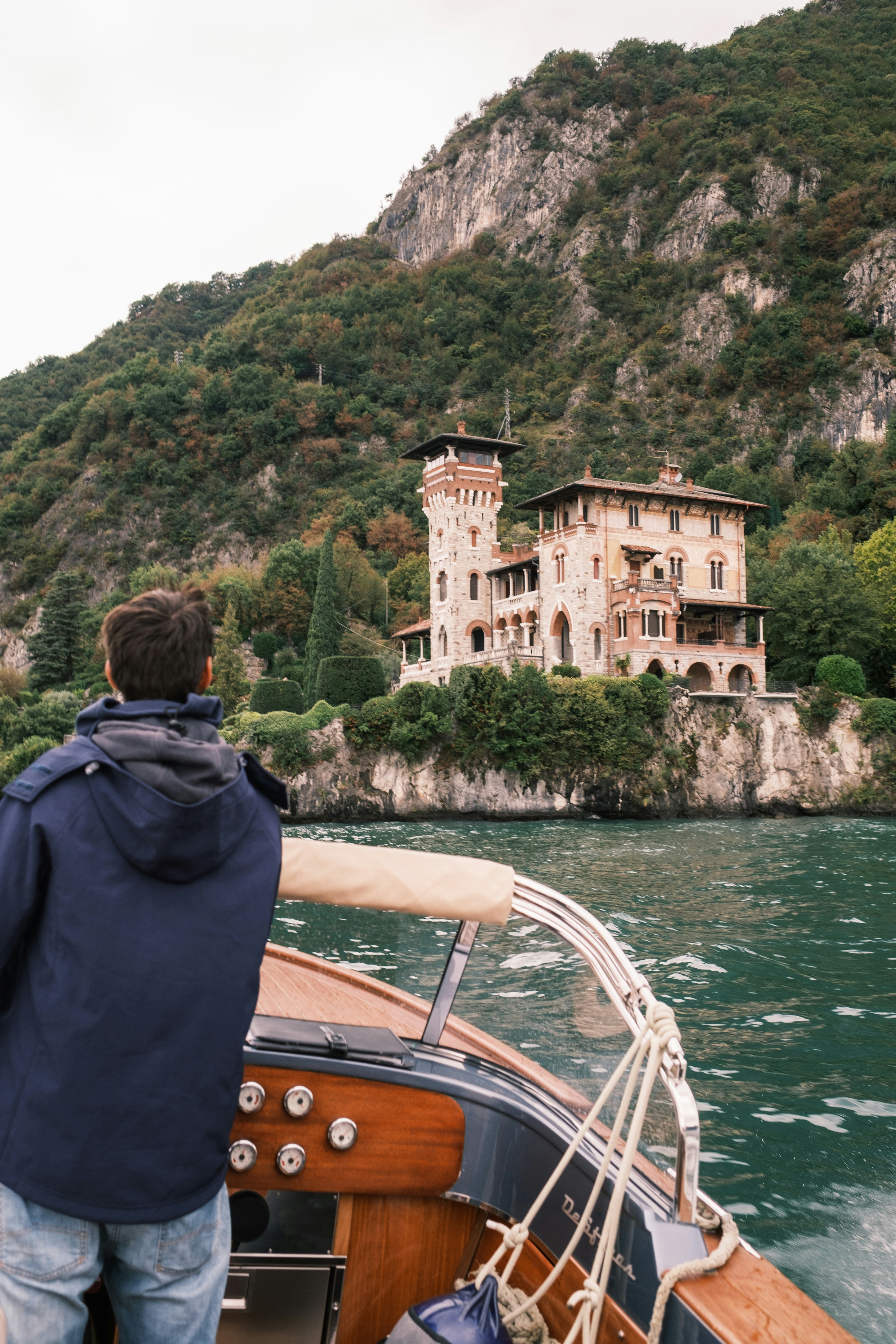 Beyond the Boat: A Cottage Vista Rising from emerald Waters