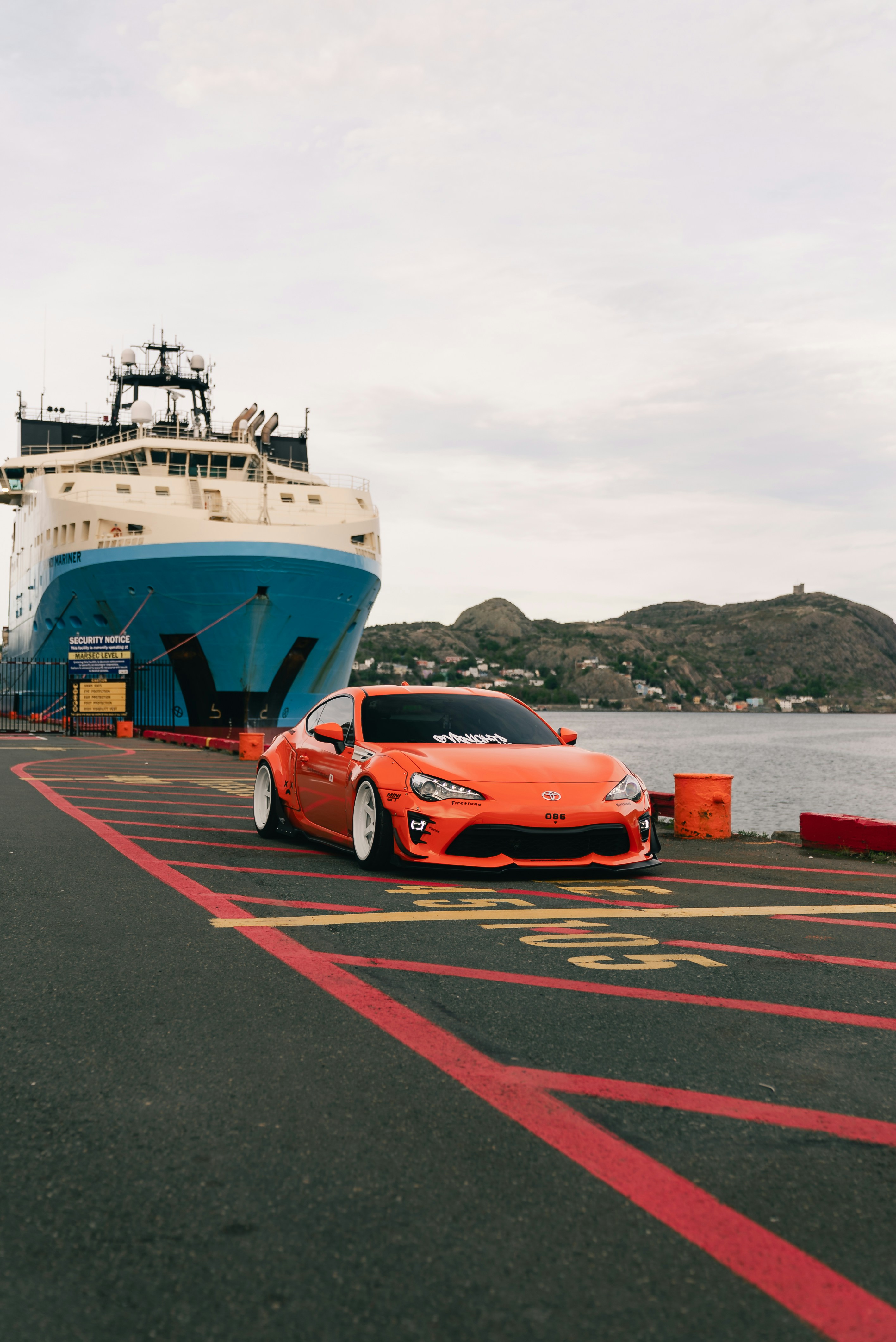 Orange Velocity at the Dock: A Stance by the Pier