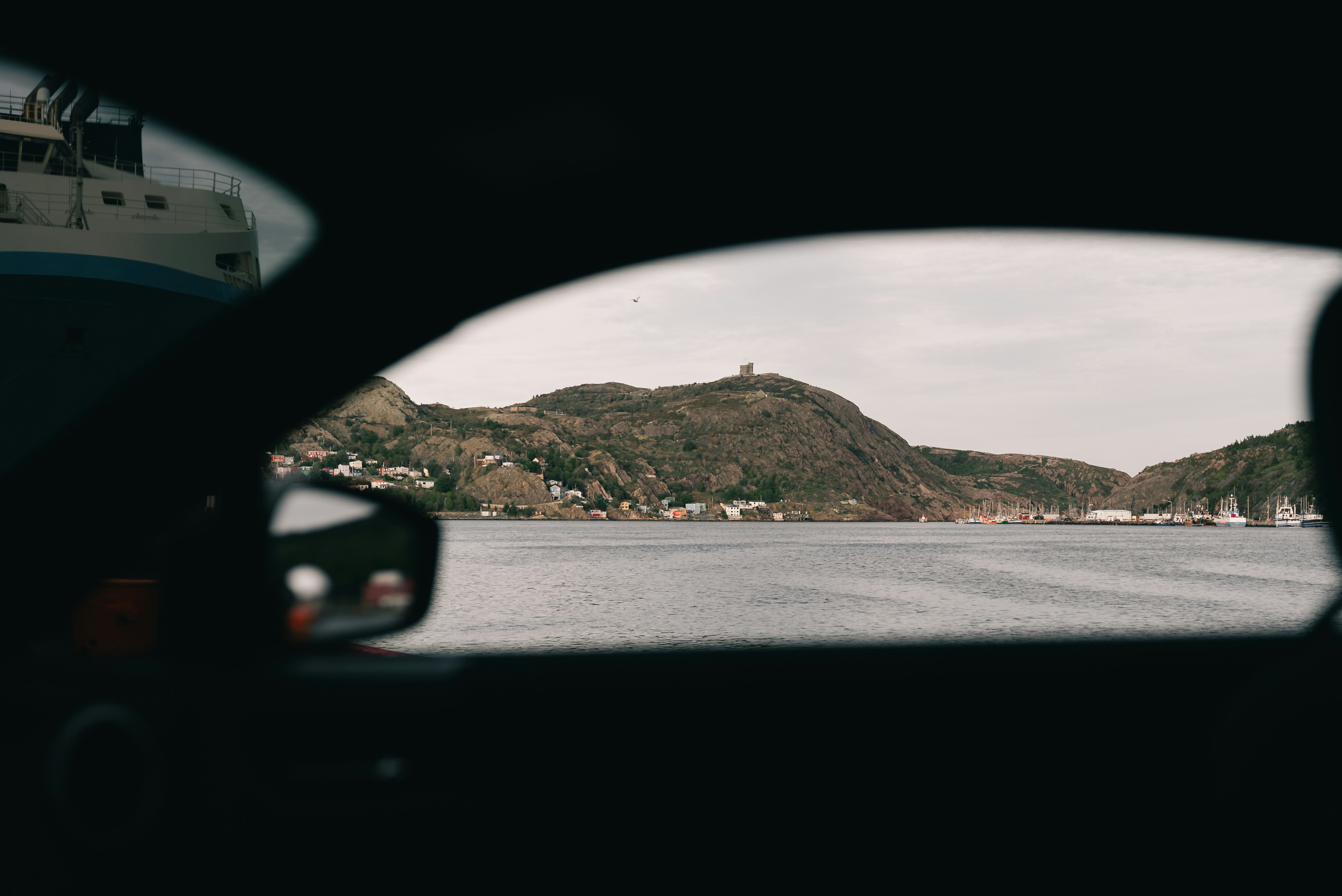 Window to the Harbor: Framed Landscape from a Darkened Cab