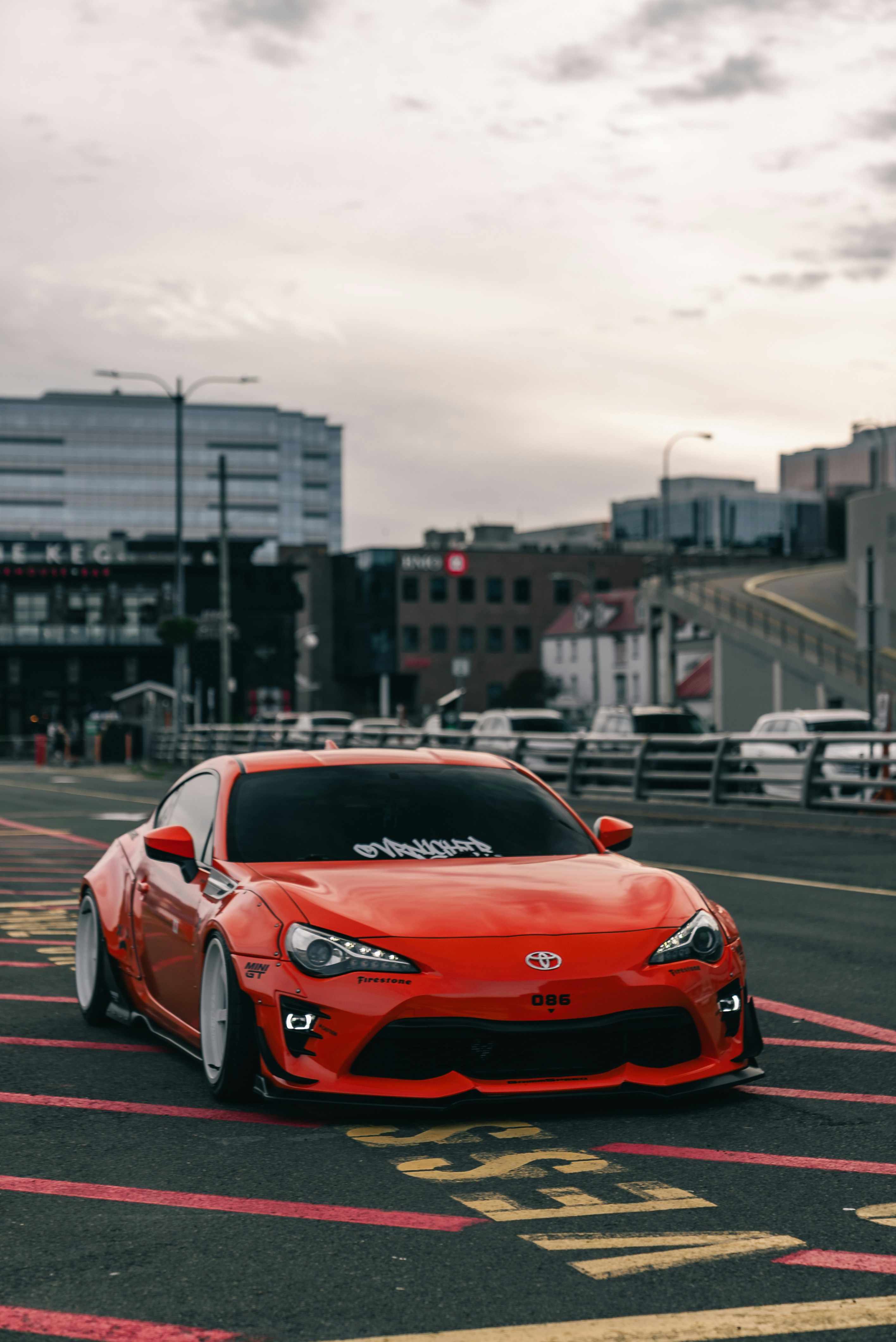 Red Streak: A Low-Slung Dream Car Anchors the Urban Crossing