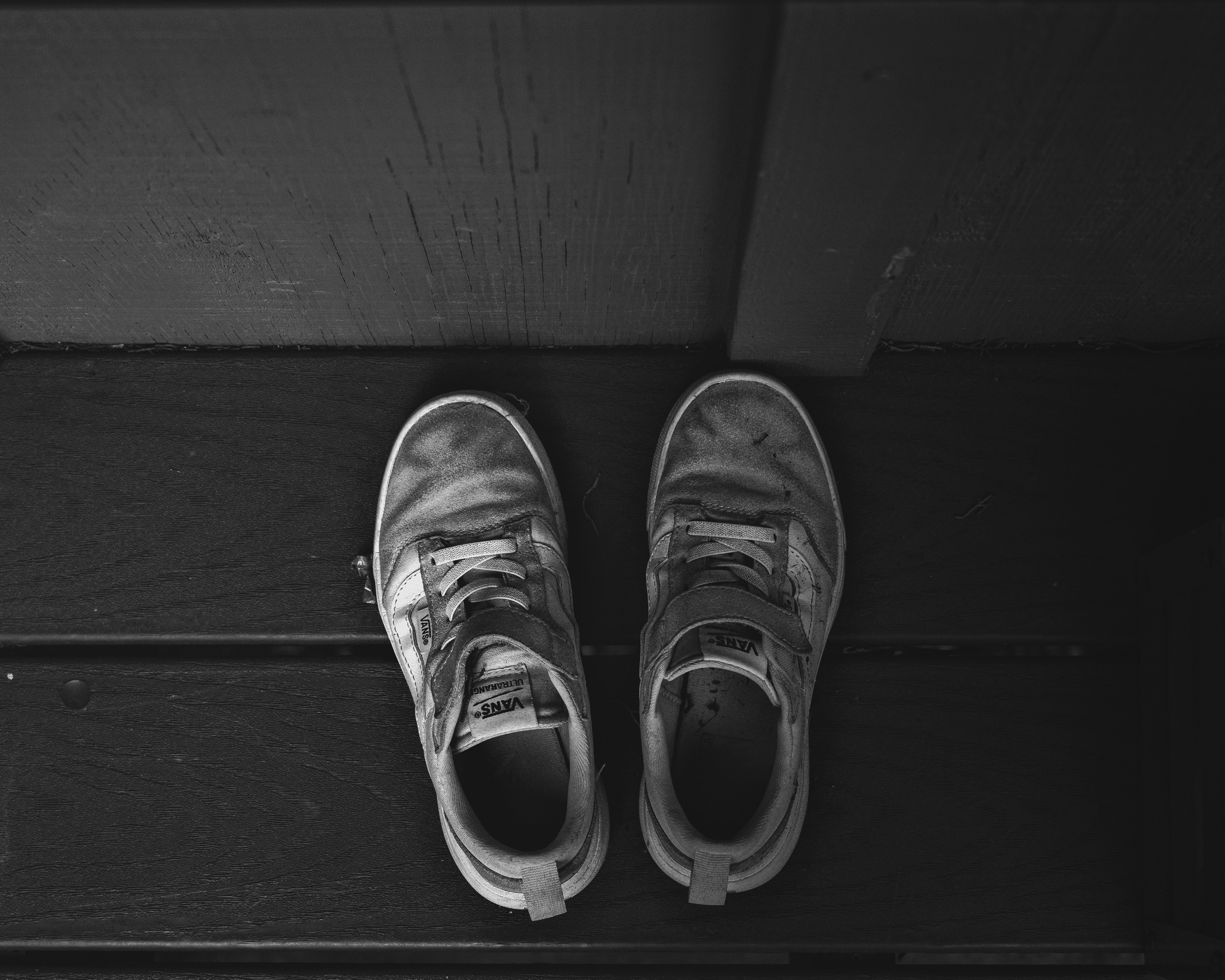 Two Sneakers, One Quiet Step: A Monochrome Moment on the Stairs