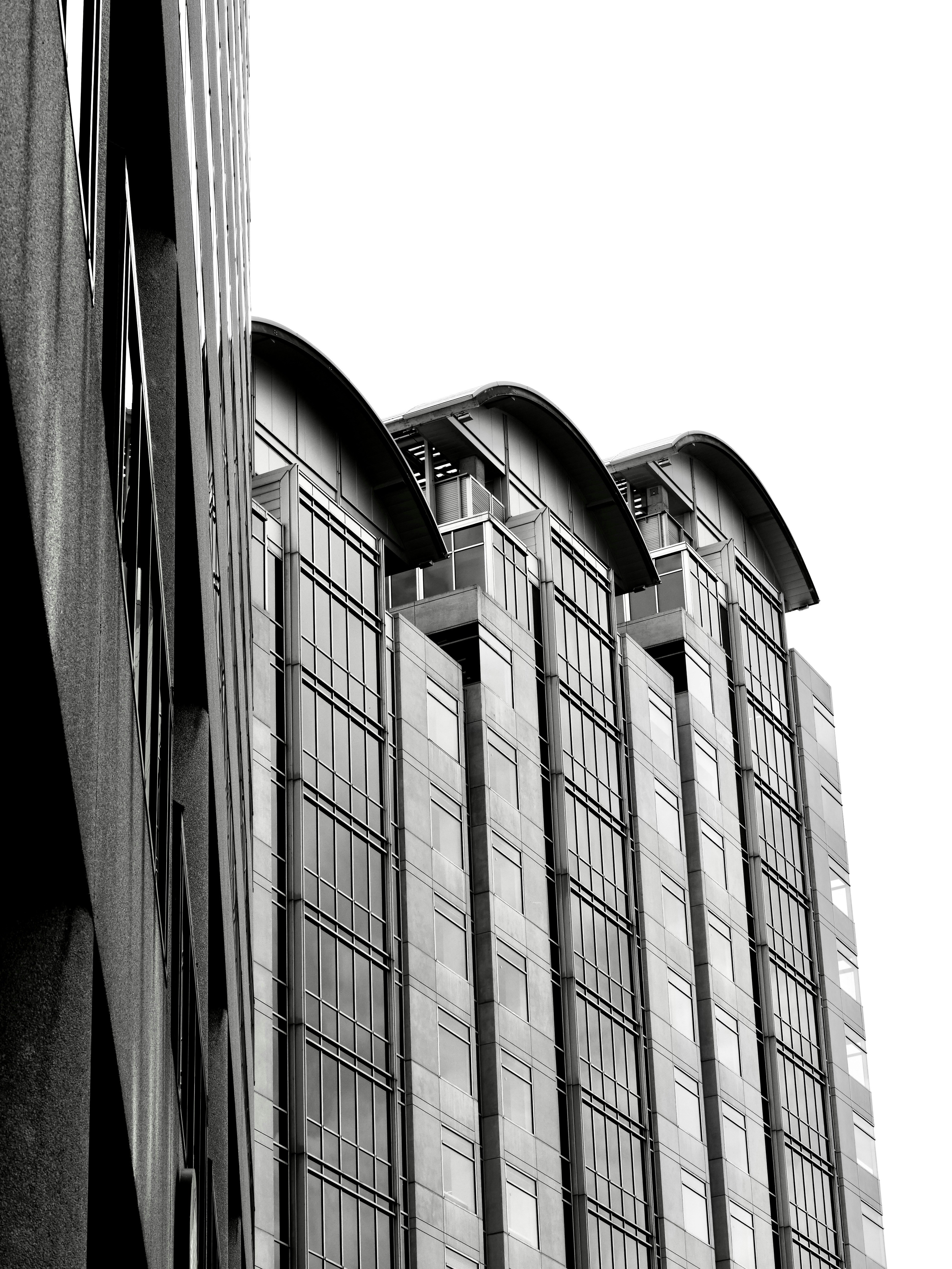 Verticaly Striated Skyline: Curved Rooflines and Glass Facades