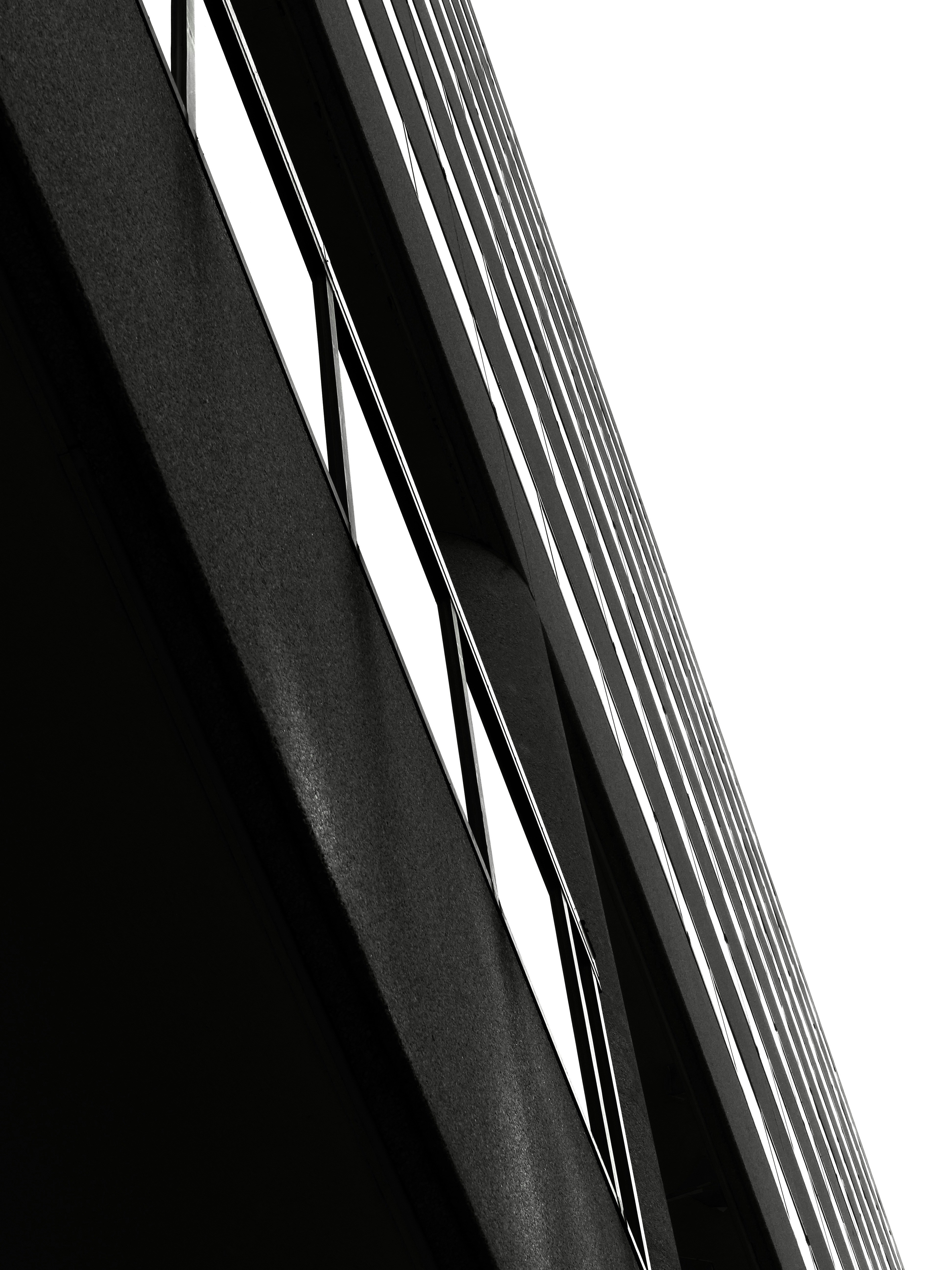 Sharp Lines: Diagonal Facade Stripes against White Sky