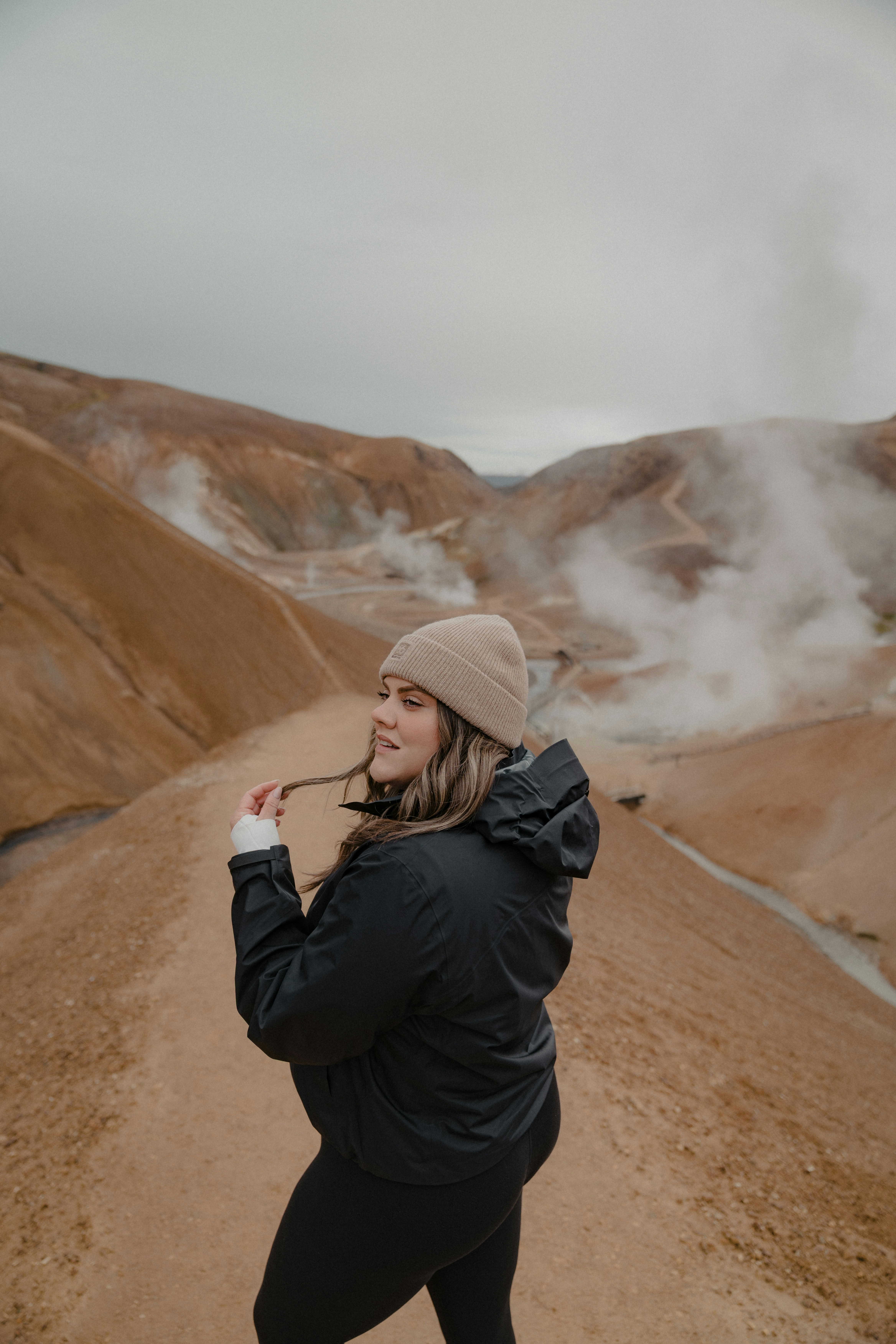 Cozy Summit: A Quiet Portrait Amid Steam and Sand