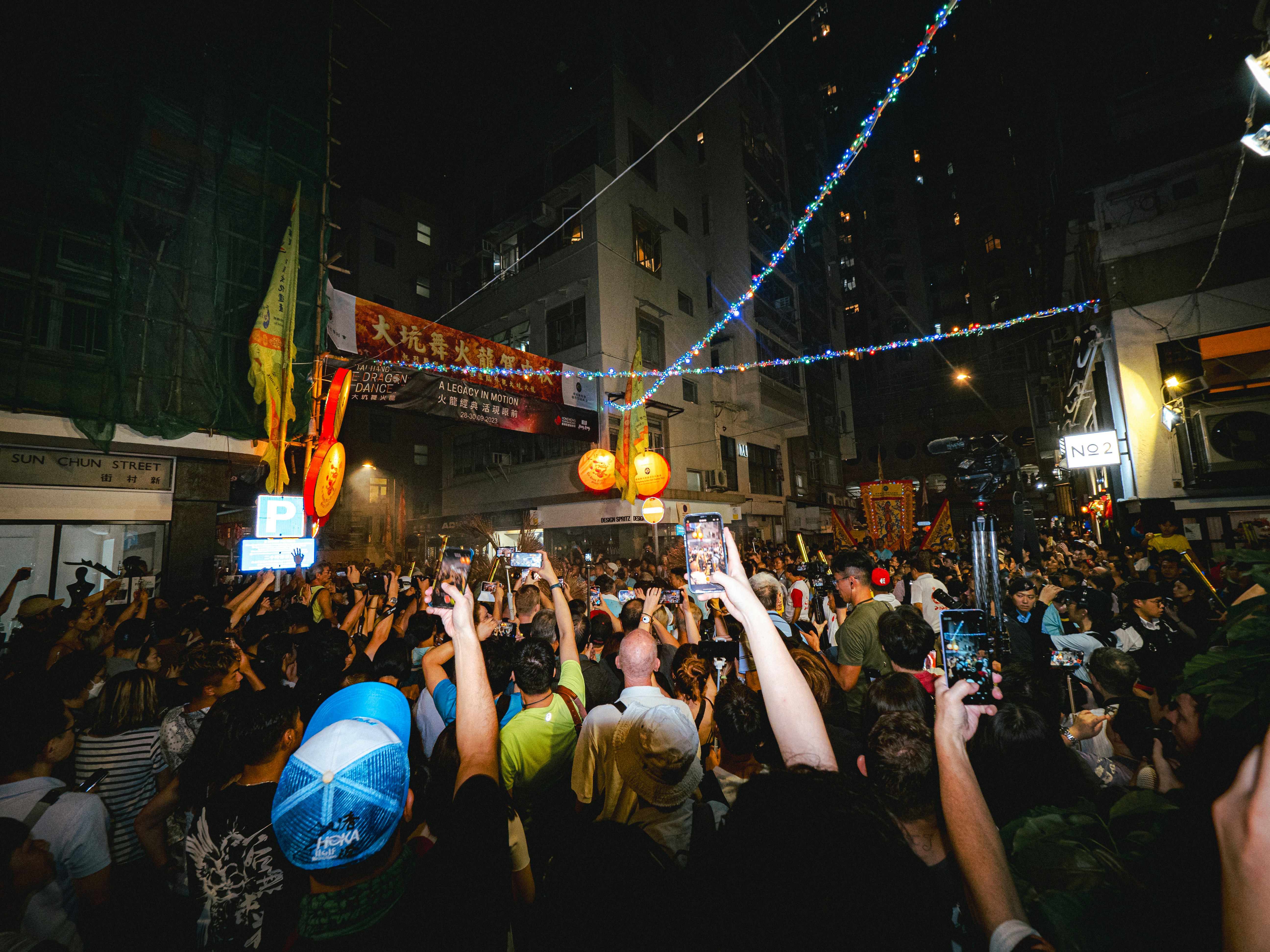 Midnight Parade: Smartphones Alight a Dense Street Stage