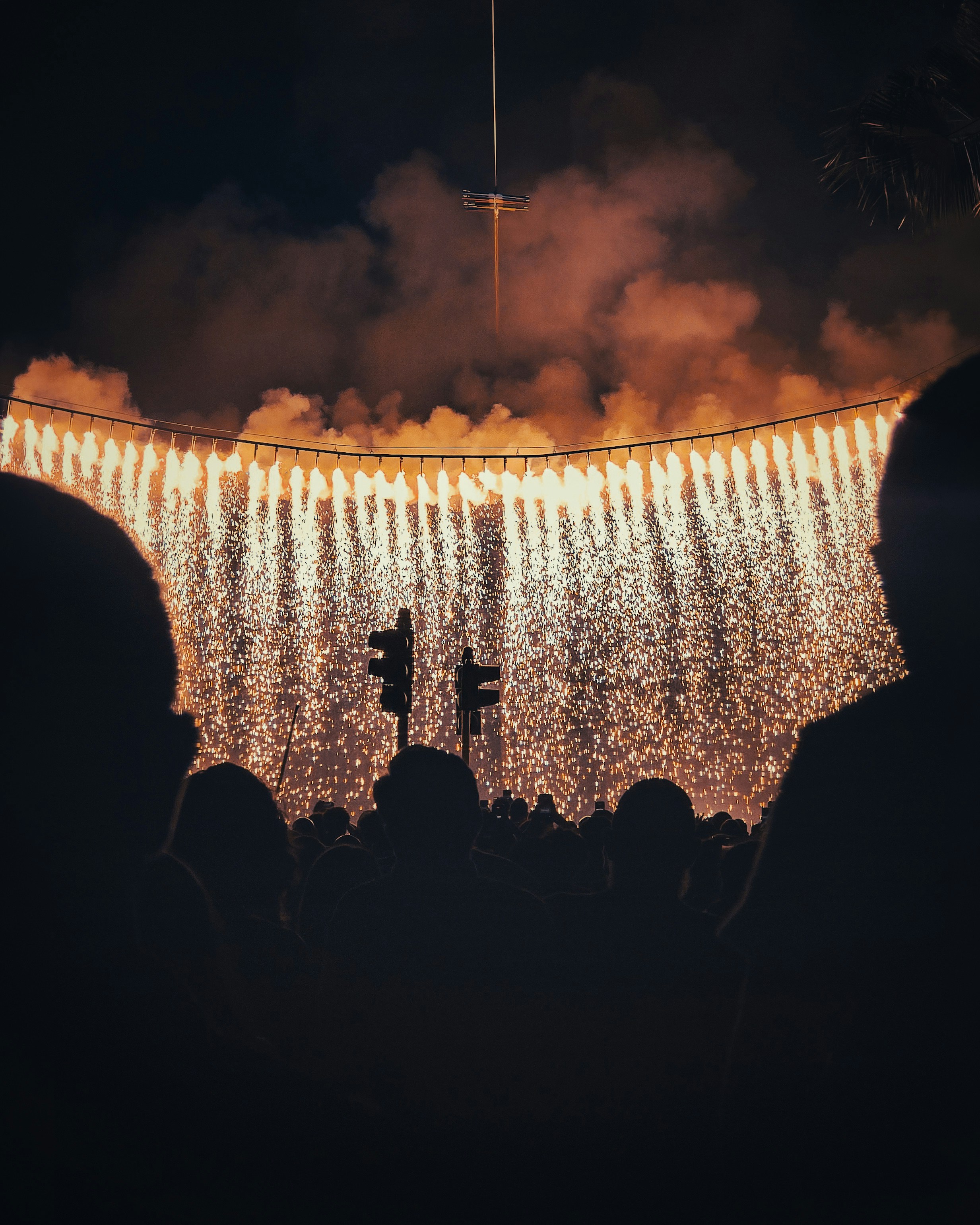 Midnight Cascade: Firework Curtain Over a Silent Crowd