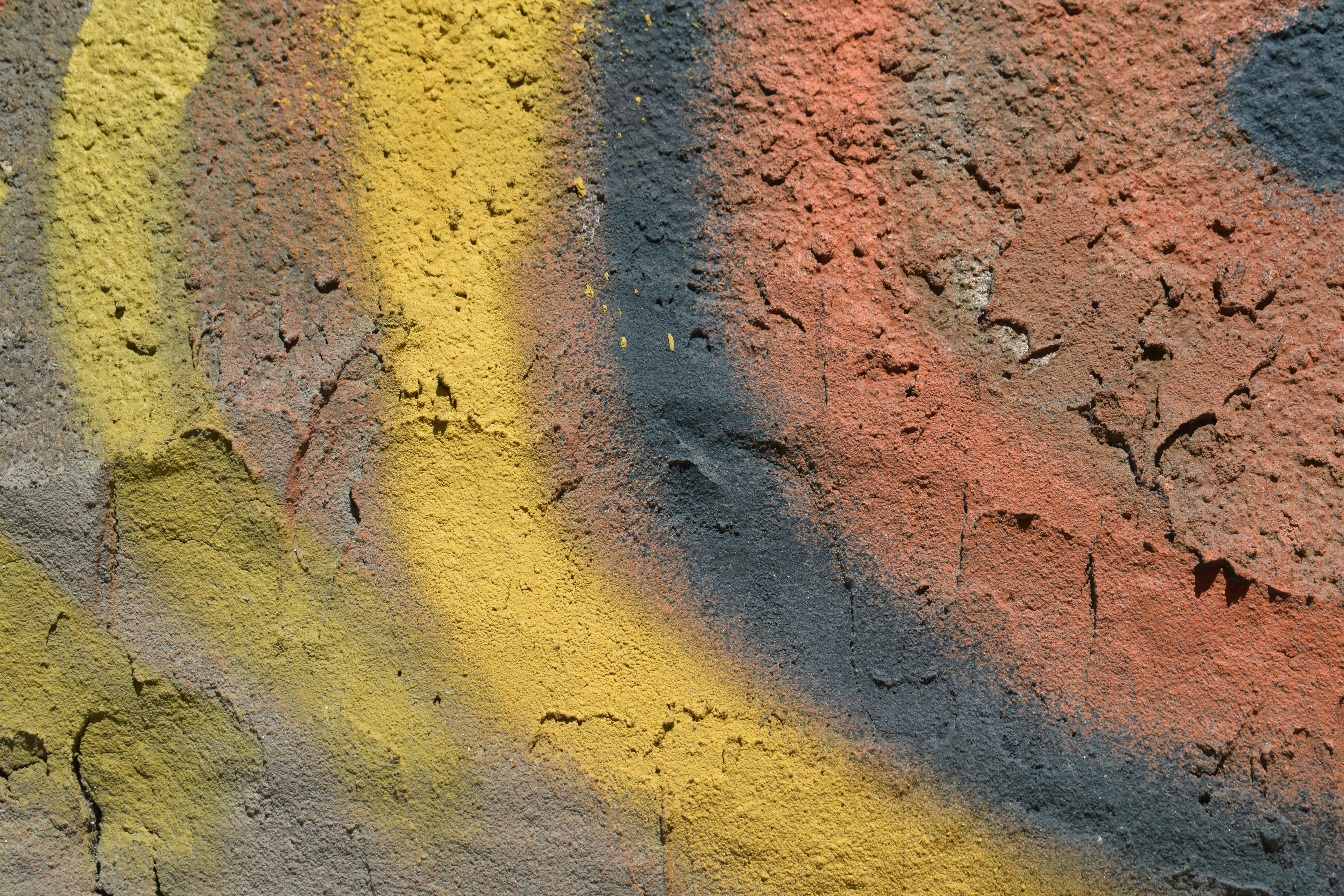 Vivid Graffiti Arc Piercing a Cracked Wall