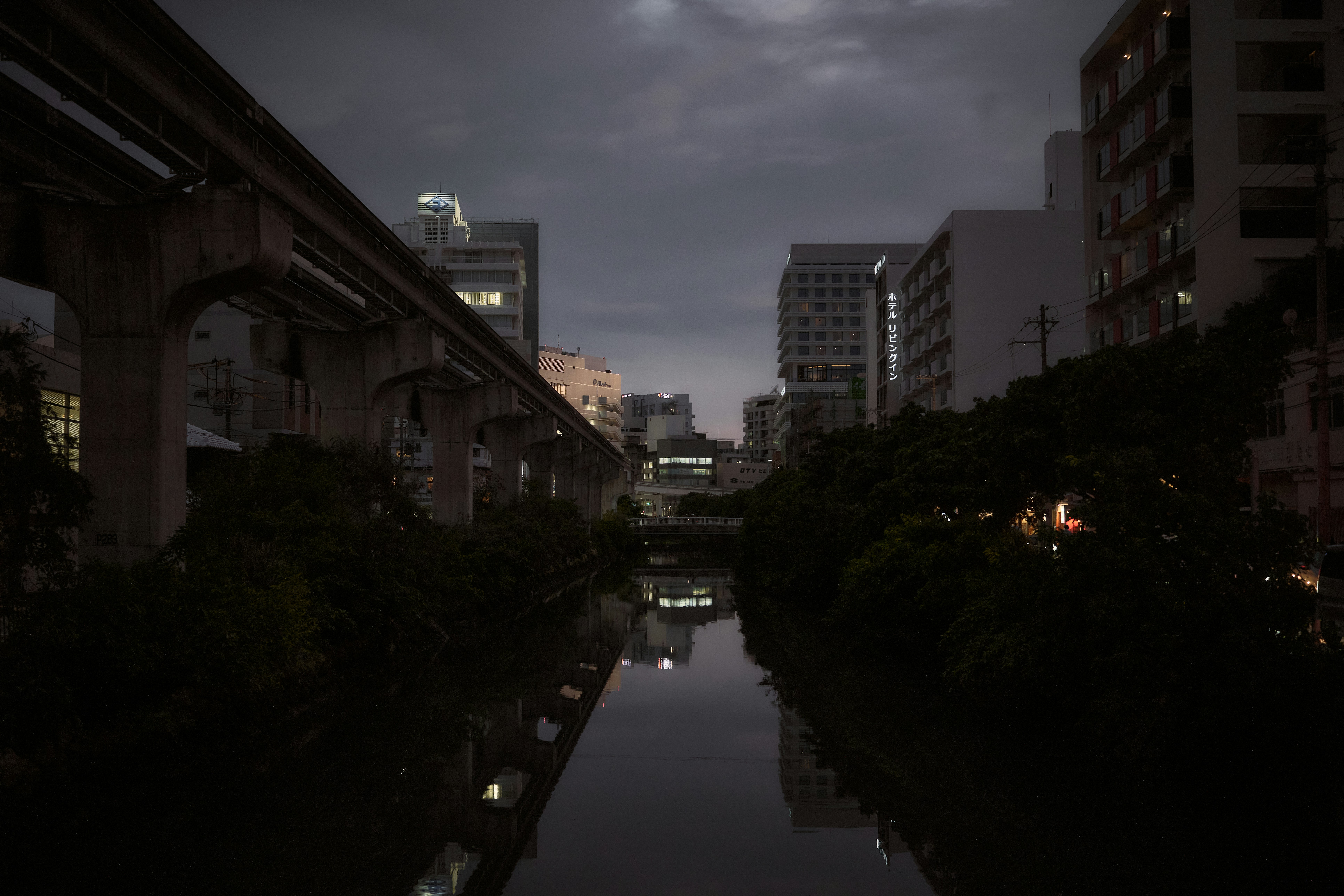 Midnight Canal: City Lights Reflected in Still Water