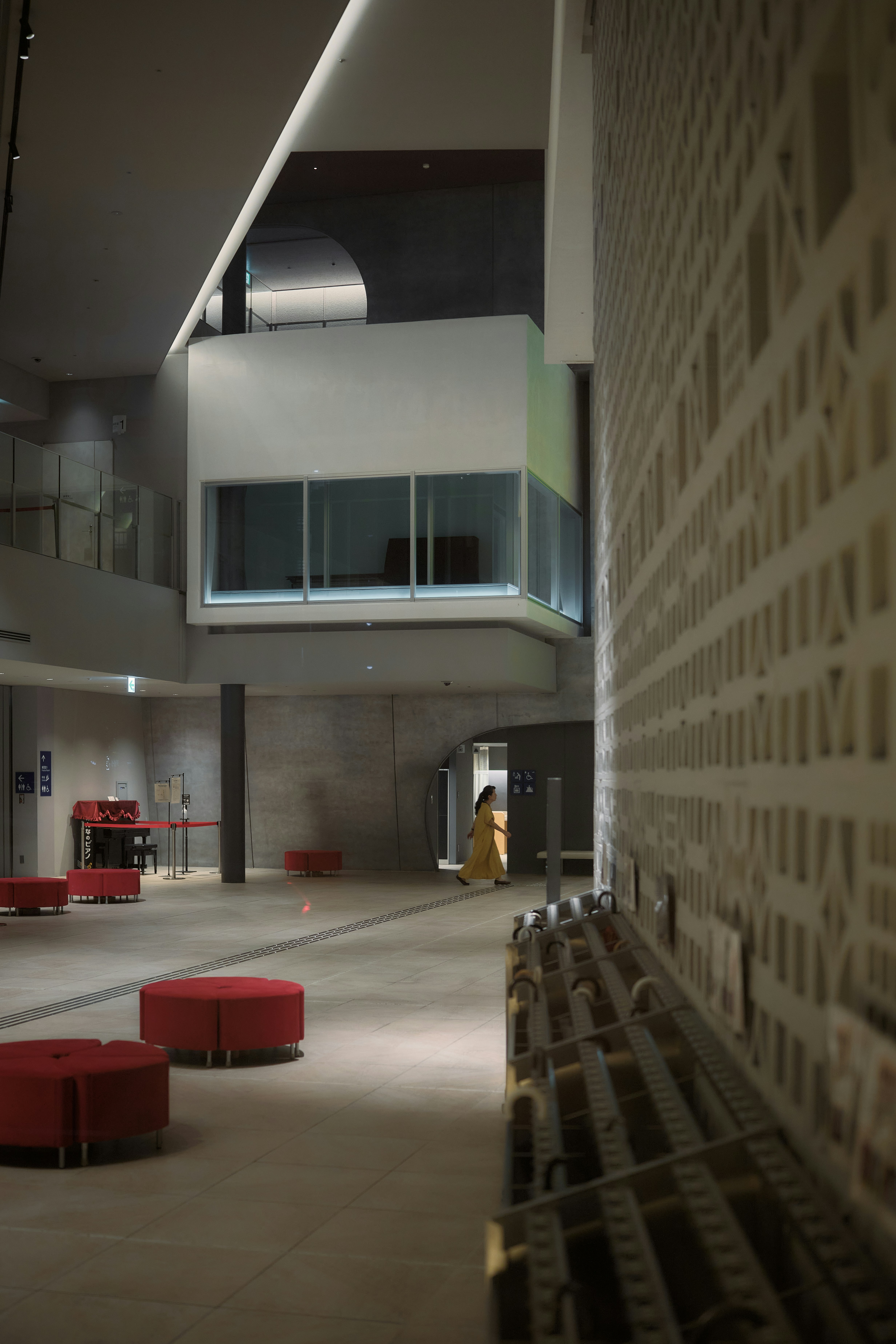 Silent Atrium: A Figure in Amber Walks the Grand Hall