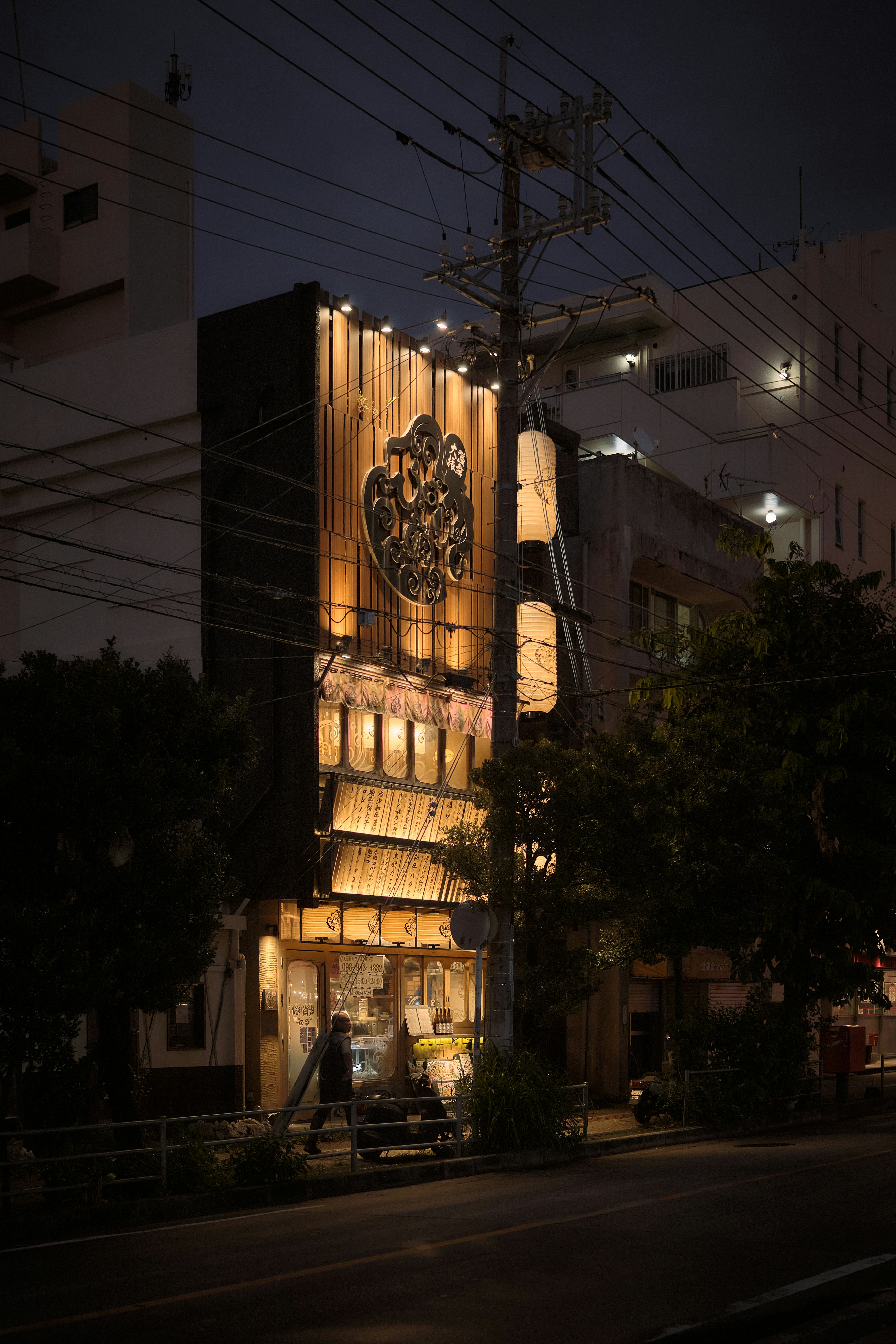 Warm Lanterns and Wooden Facade: Nighttime Studio of Light