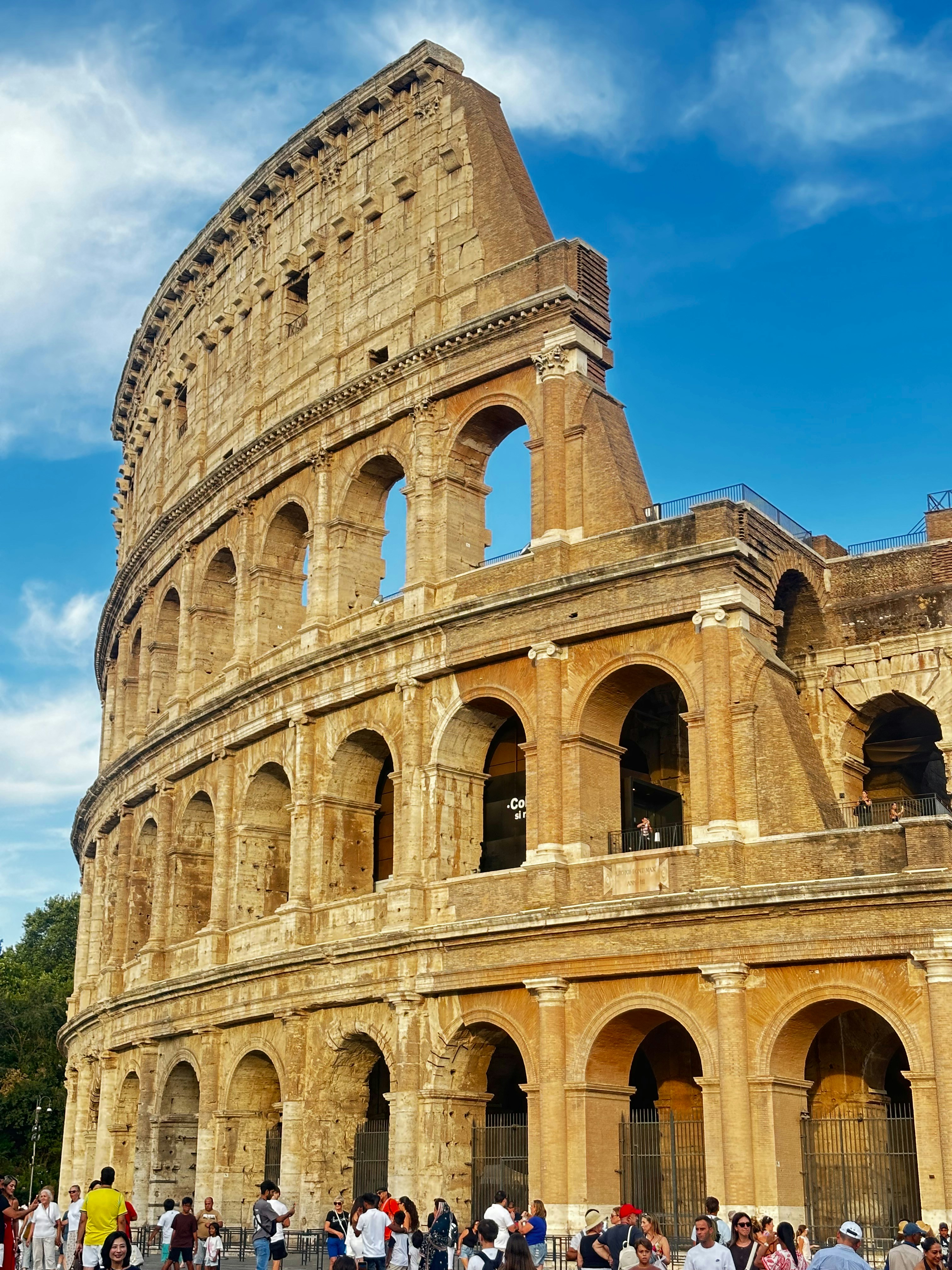 Colossal Curves: The Roman Colosseum Beneath a Cerulean Sky