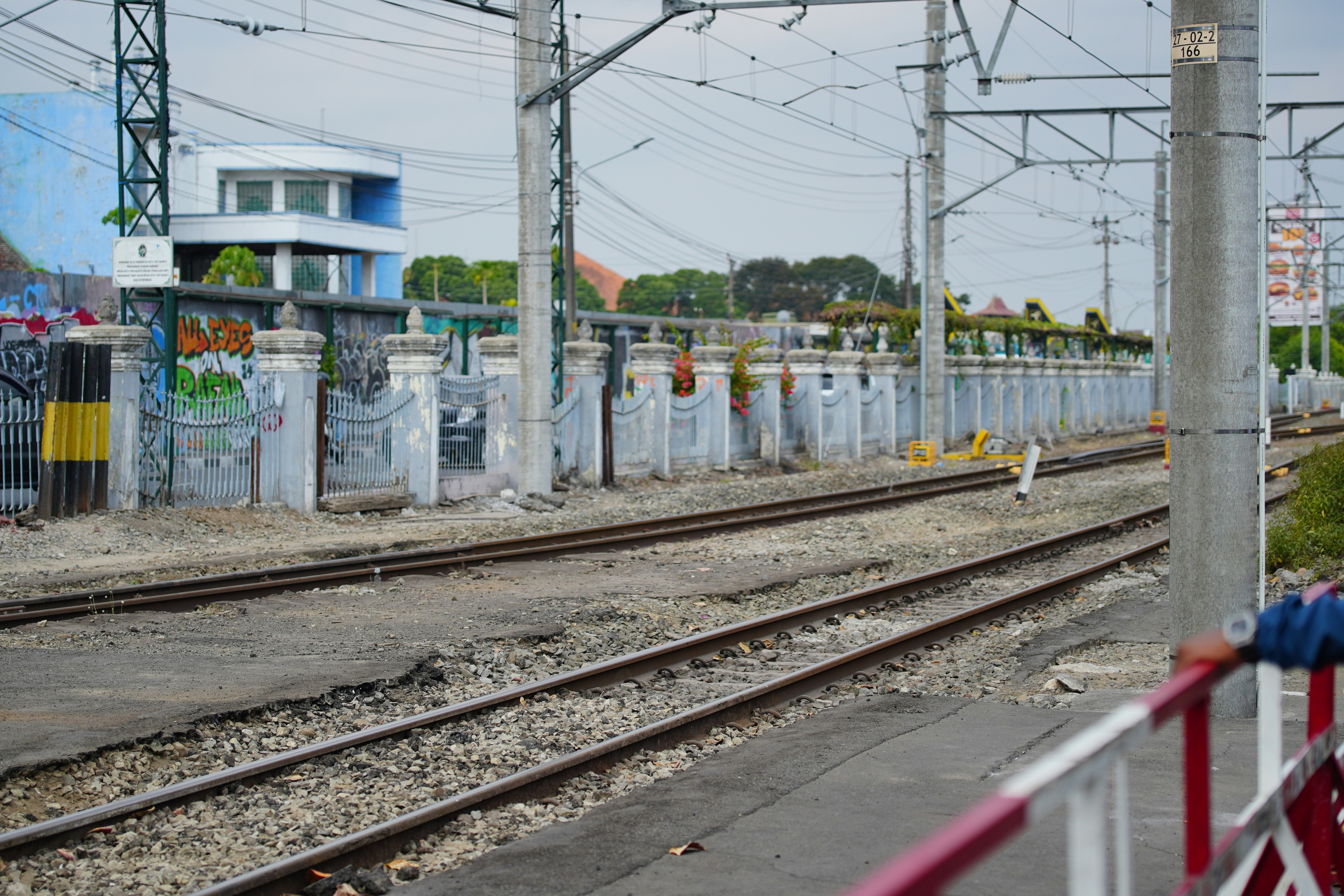 Railway Edge: Rails, Signals, and a Fenced Horizon