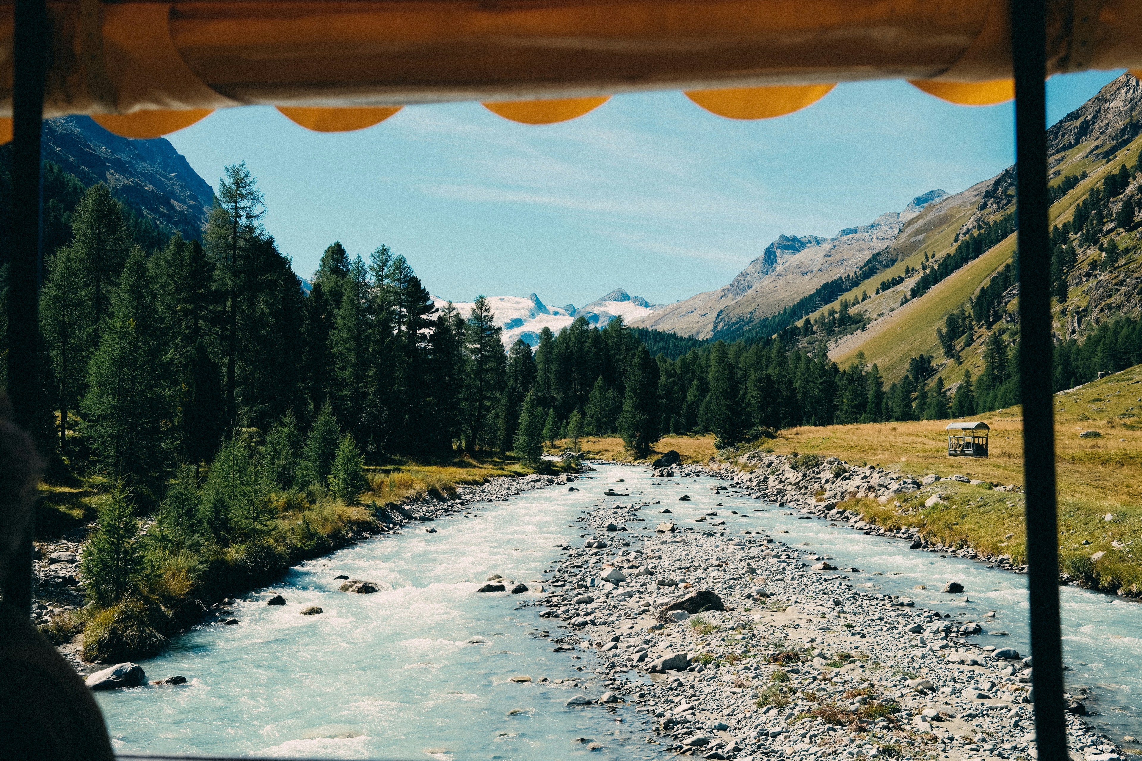 Overlooked River Crossing: Mountain Valley Vista From a Vehicle Frame