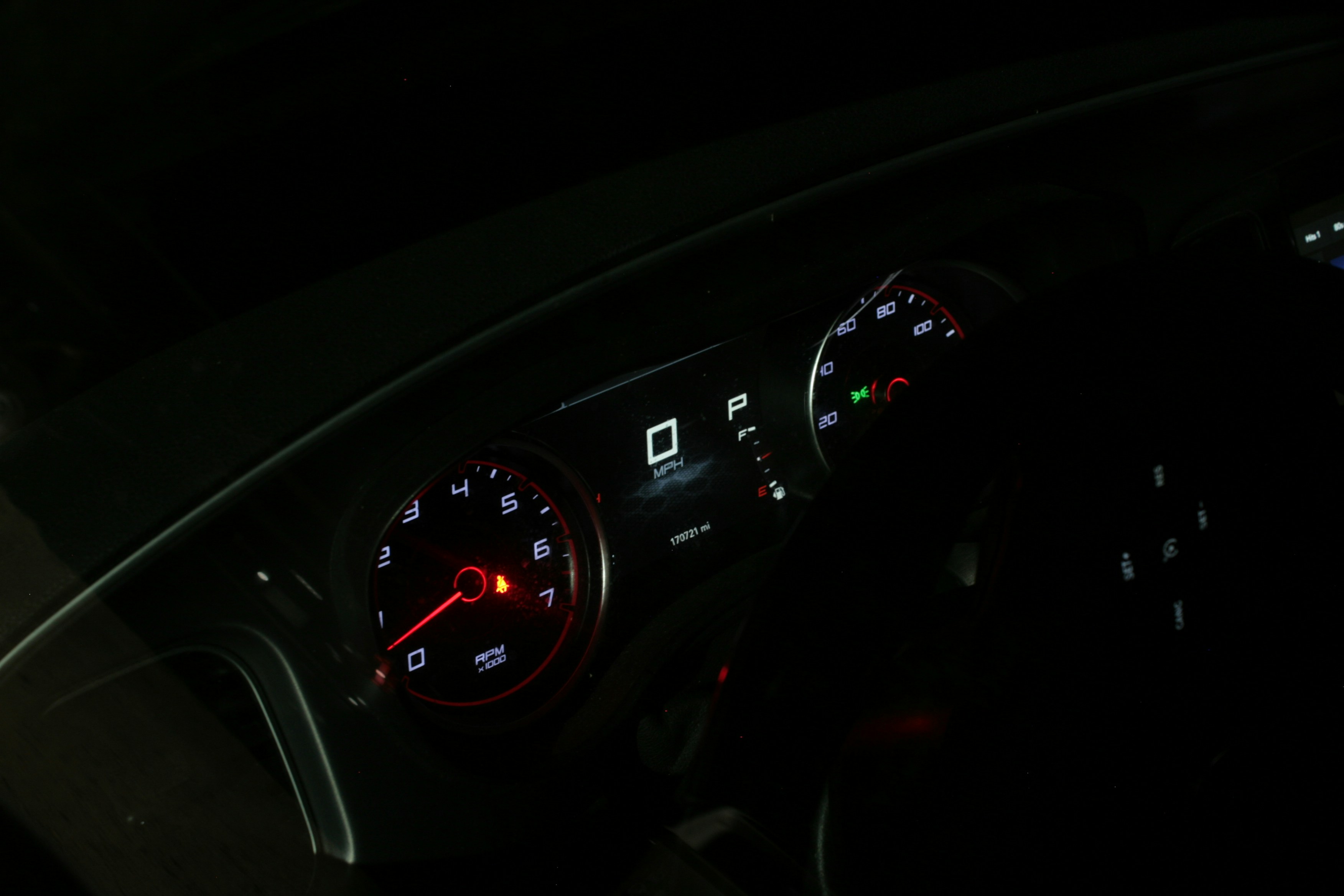 Midnight Instrument Pulse: Dim Console with Red Tachometer Glow