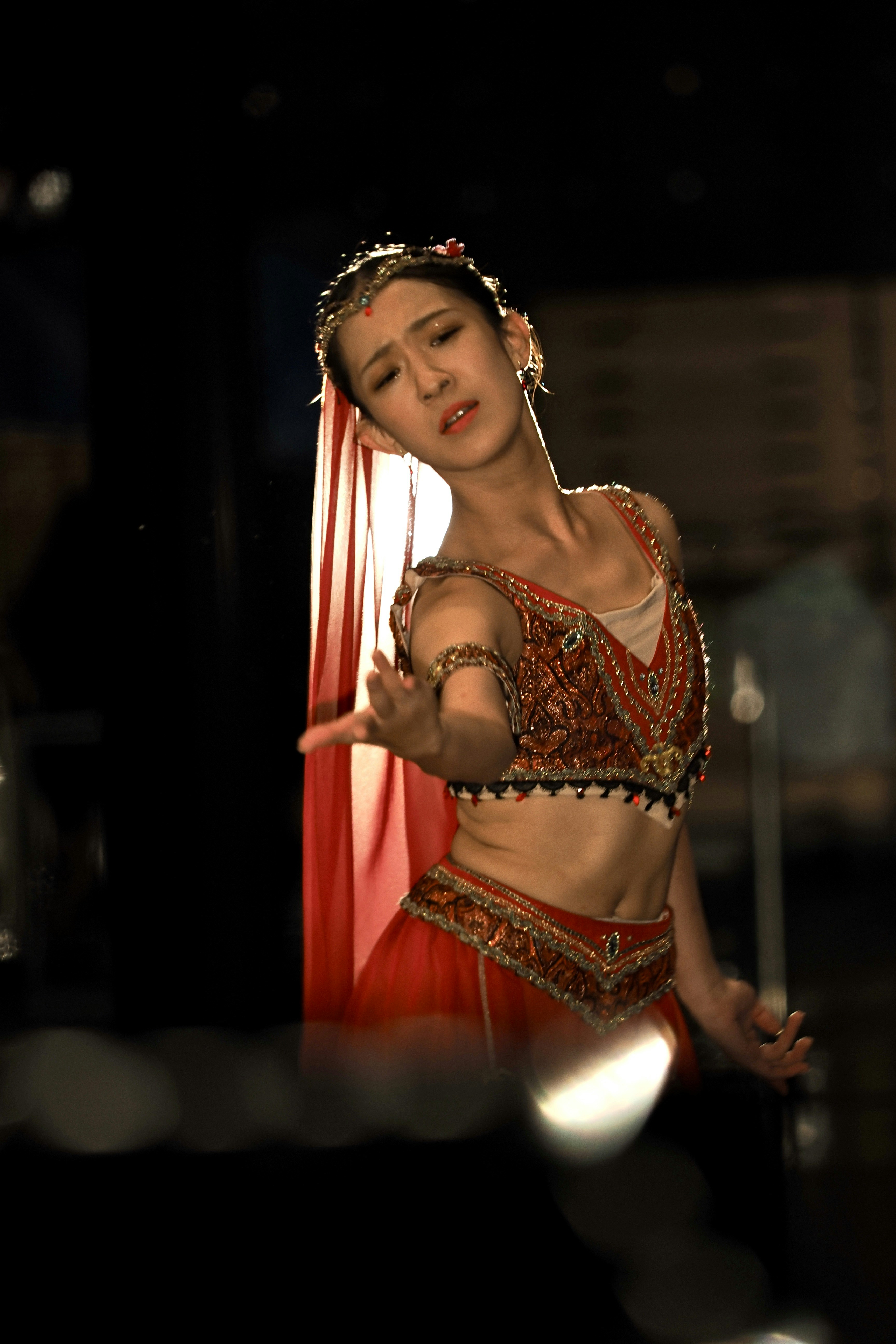 Trailing Red Veil: A Dancer in Focus