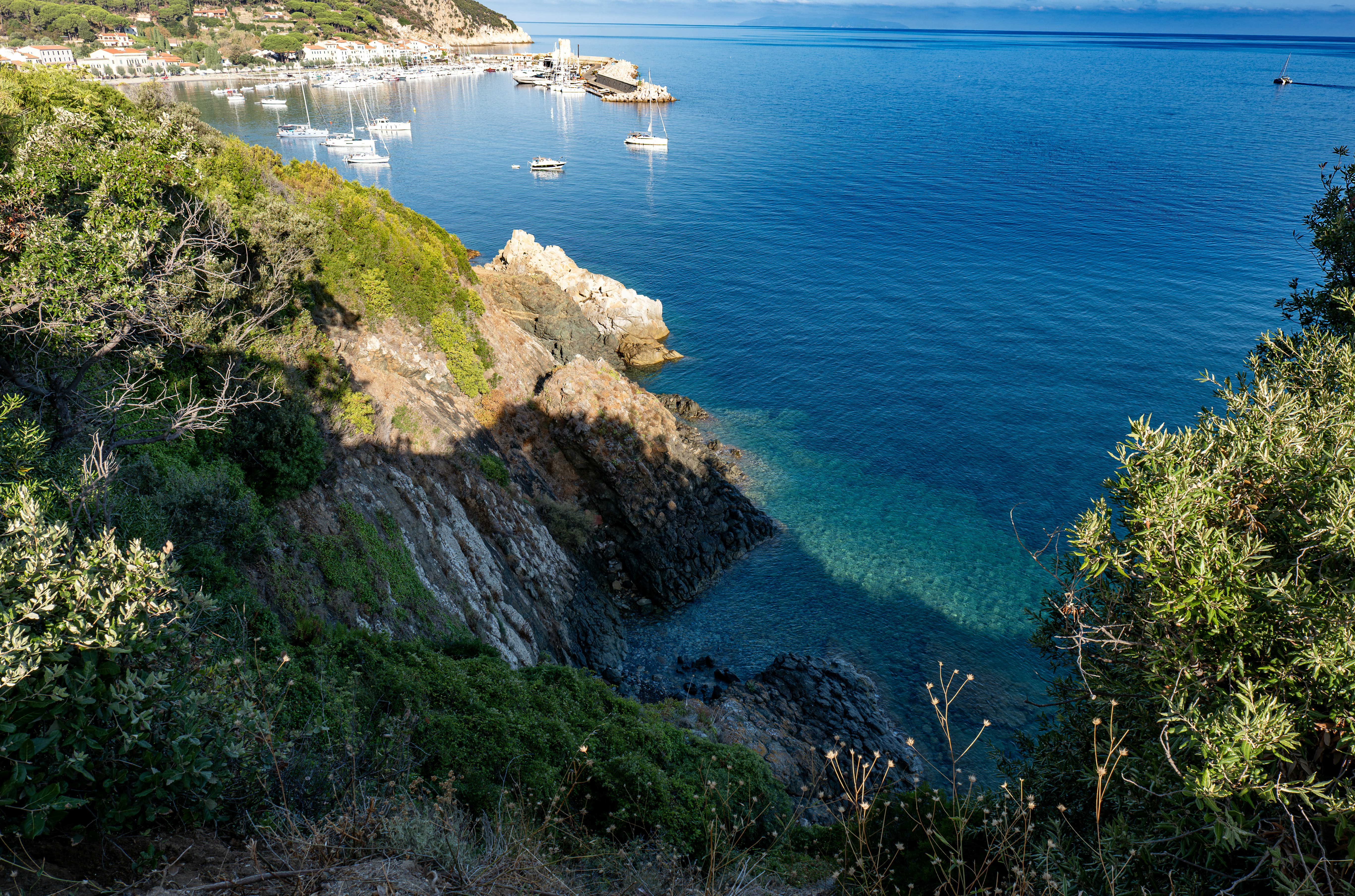 Hidden Cove: Cliffside Pathways Framing a Blue Bay