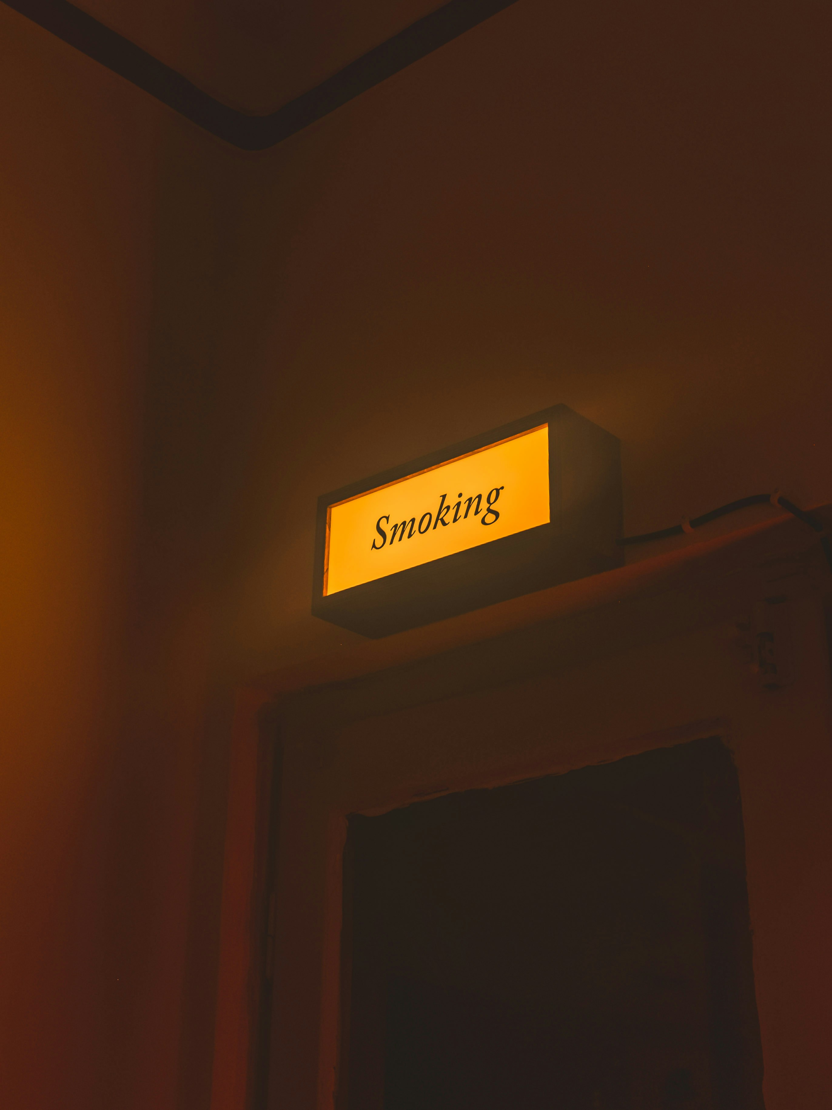 Glowing Sign in a Quiet Corridor