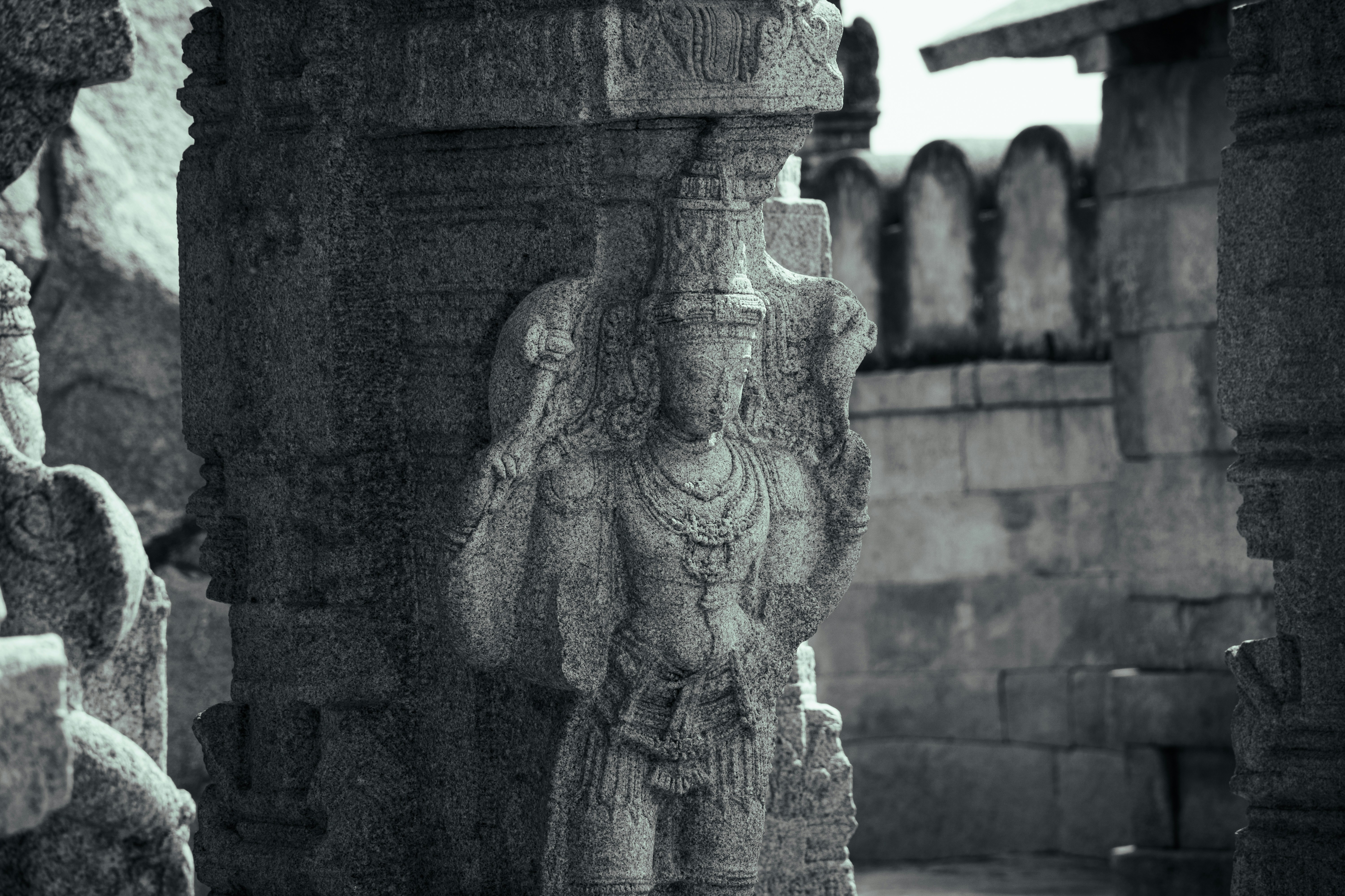 Carved Sentinel: Stone Deity Guarding Ancient Steps
