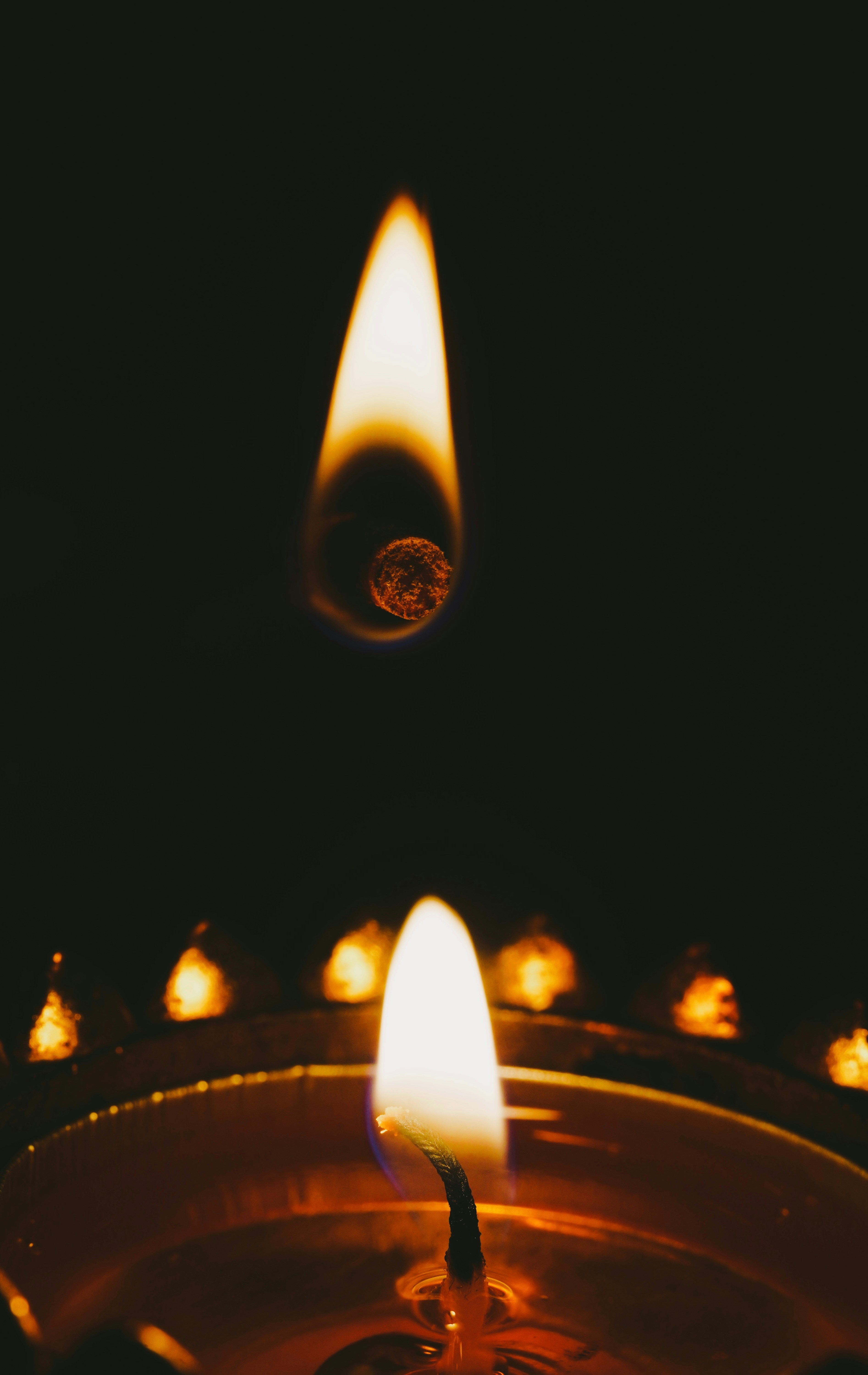 Single Flame, Quiet Moment: A Candle's Glow in the Darkness