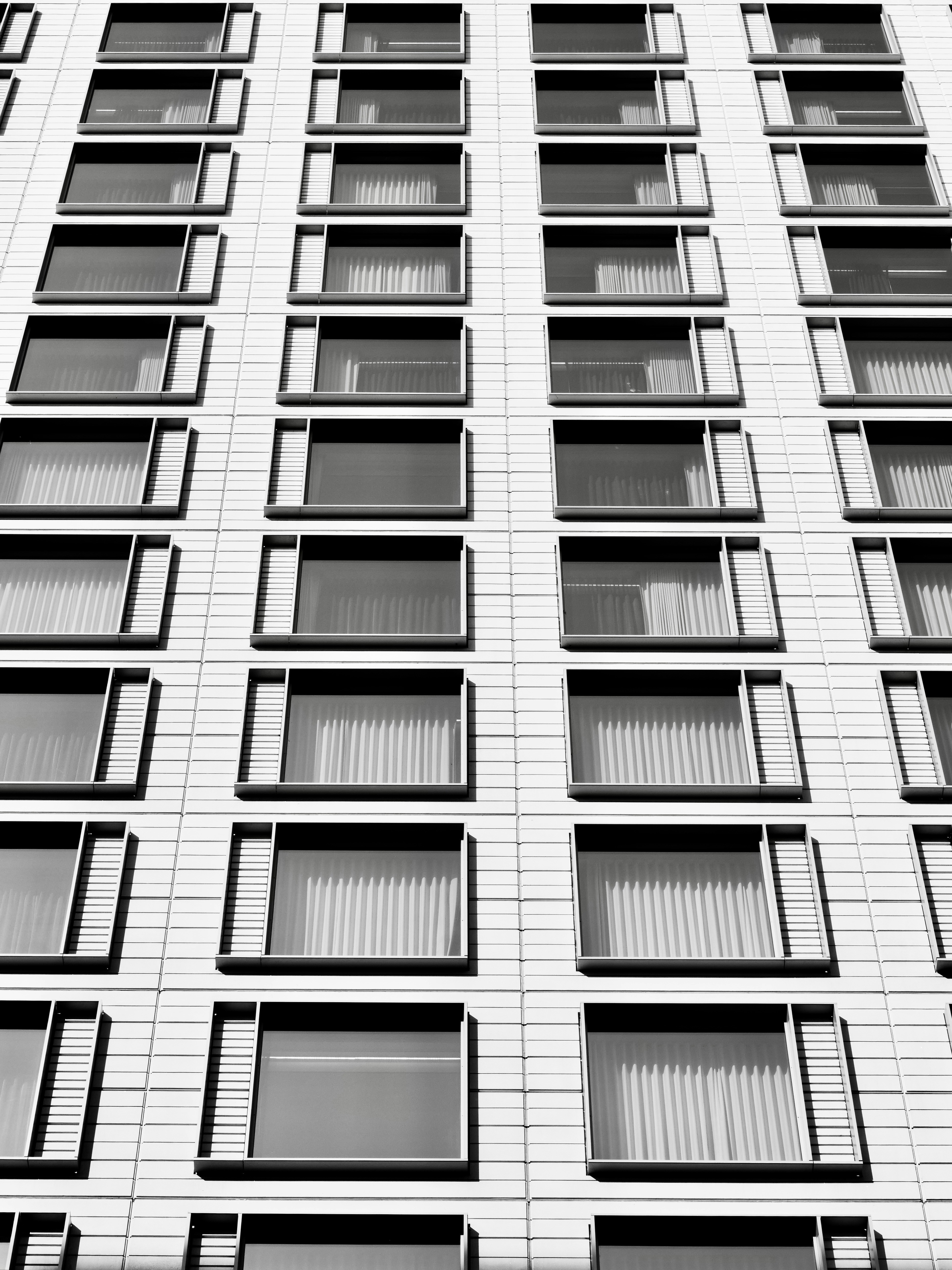 A Windowed Grid: Repetition and Rhythm in White Facade Rows